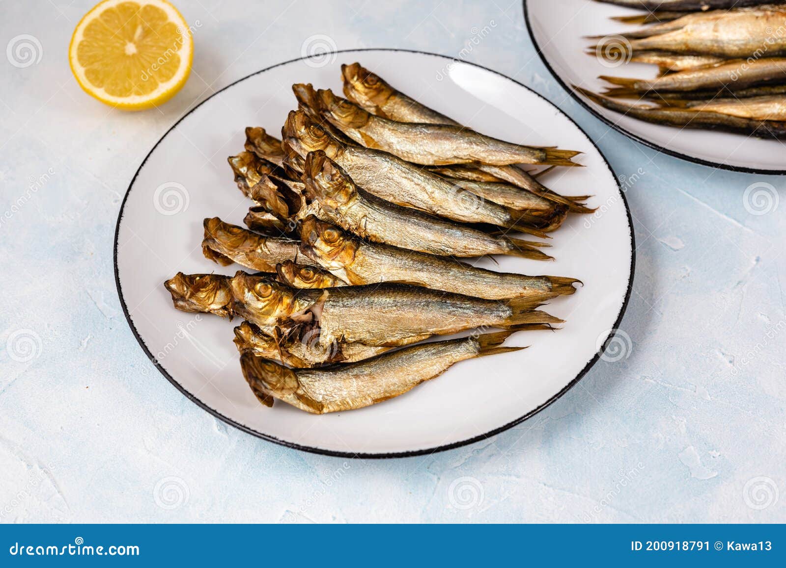 Smoked sprats on a plate stock image. Image of dish - 200918791