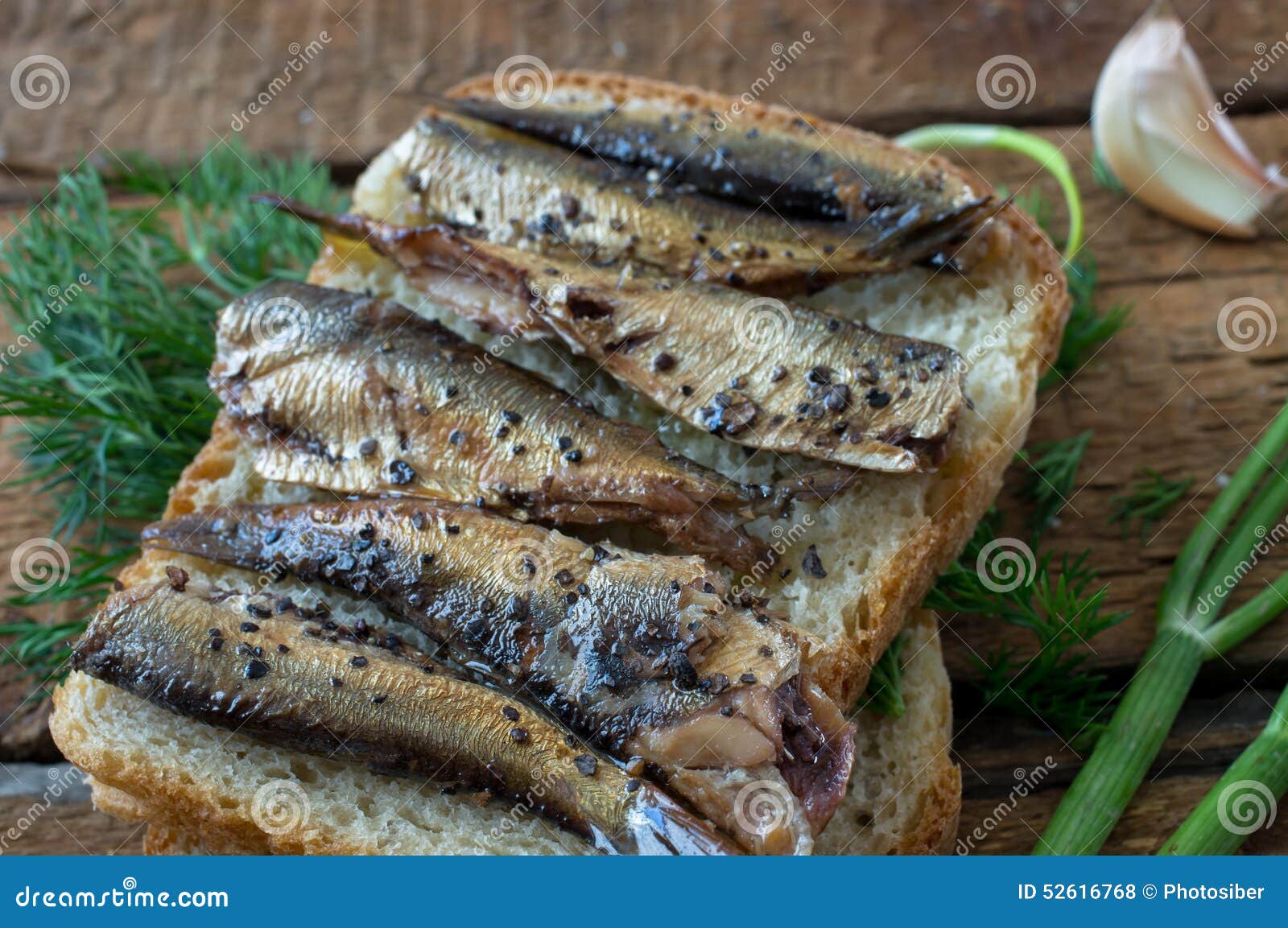 Smoked sprats on toast stock photo. Image of breaded - 52616768