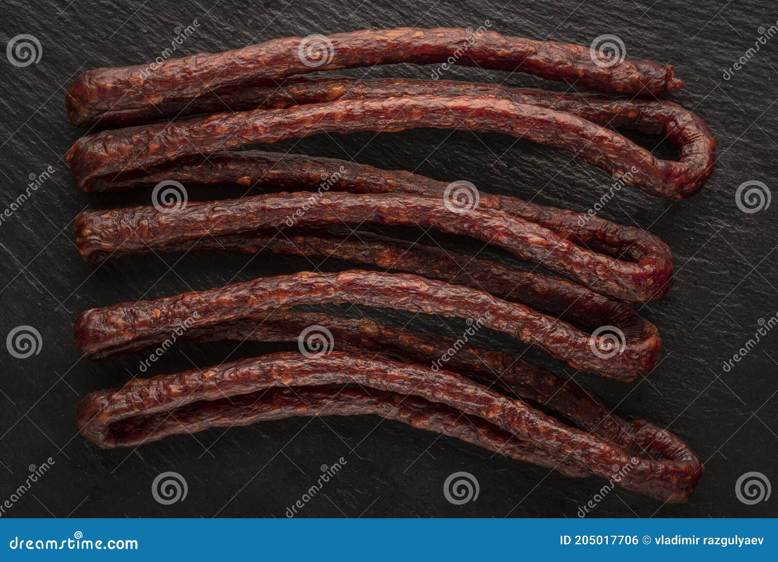 Smoked Thin Sausage Long, Texture on a Black Background. the View from ...