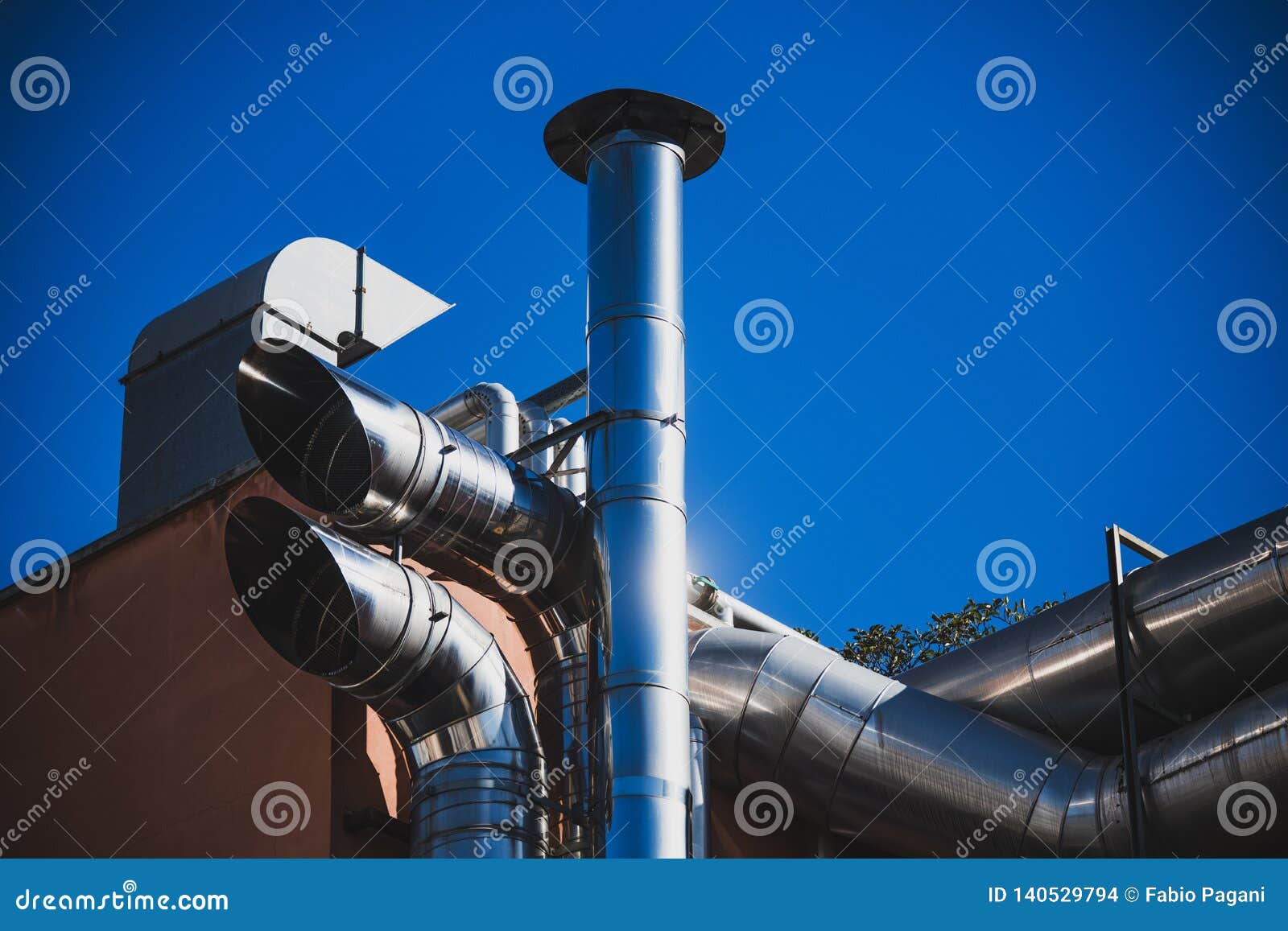 Smokestack Pipeline on Building Side Stock Photo - Image of outdoors ...