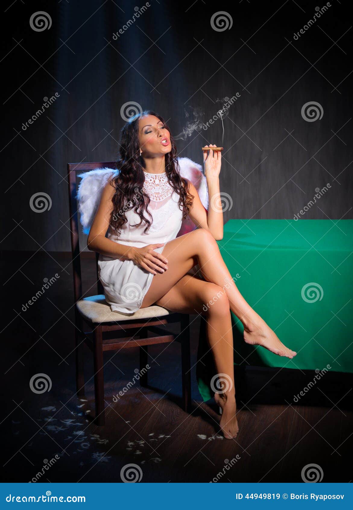 Smoking angel sits stock image. Image of light, danger - 44949819