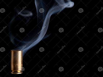 Smoking bullet casing stock image. Image of smoke, black - 23153025
