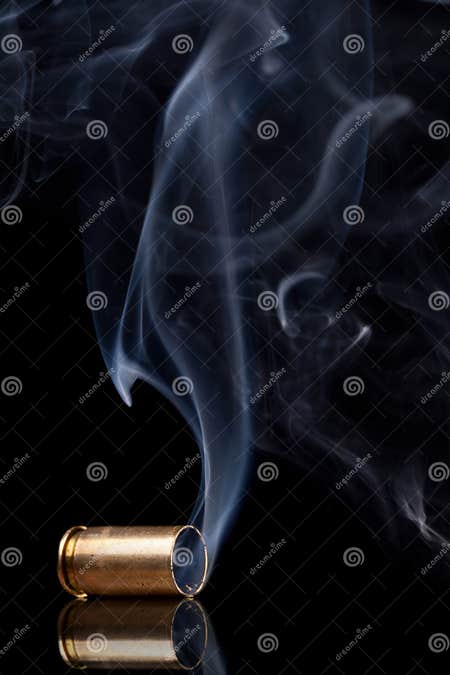 Smoking bullet casing stock image. Image of shell, ammunition - 23153029