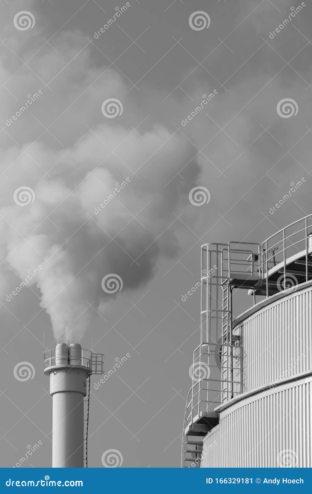 A Smoking Chimney Next To a Silo Stock Image - Image of chimney ...