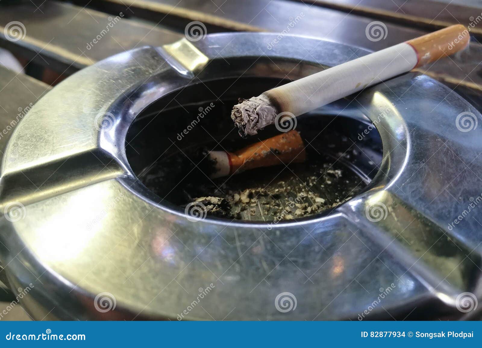 Smoking a Cigarette, Cigarette in Ashtray Stock Photo - Image of hand ...