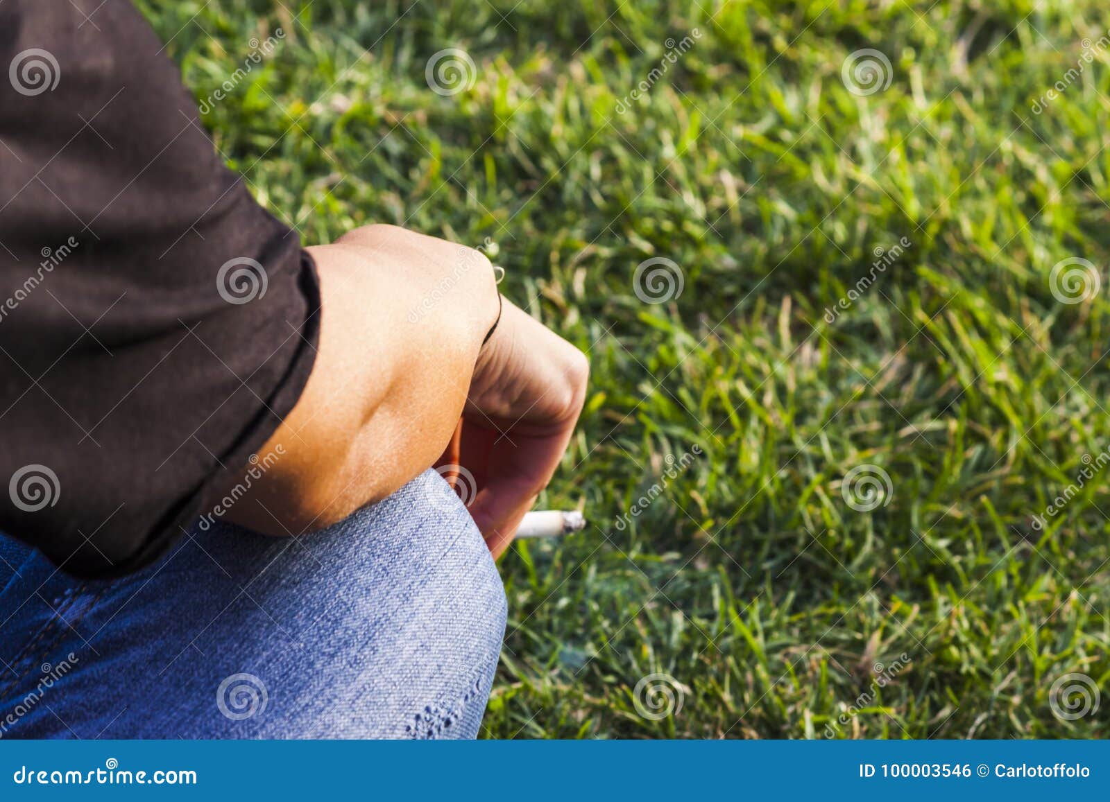 Smoking on the grass stock photo. Image of smelling - 100003546