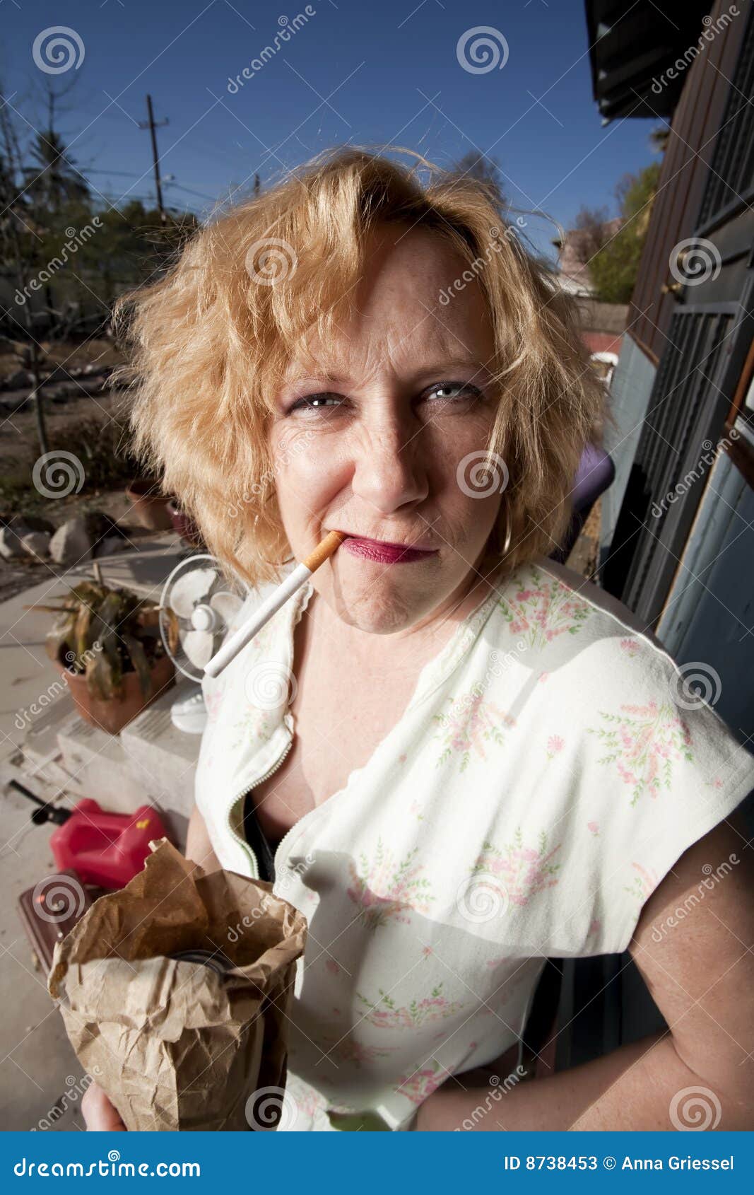 Smoking woman on her porch stock image. Image of smile - 8738453