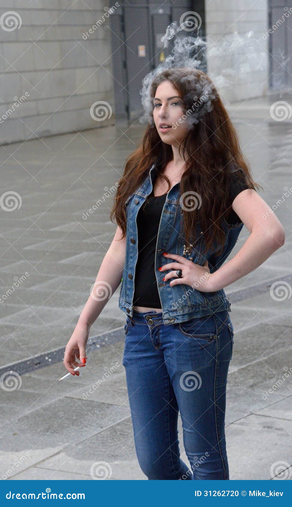 Smoking woman stock photo. Image of smoking, jeans, youth - 31262720