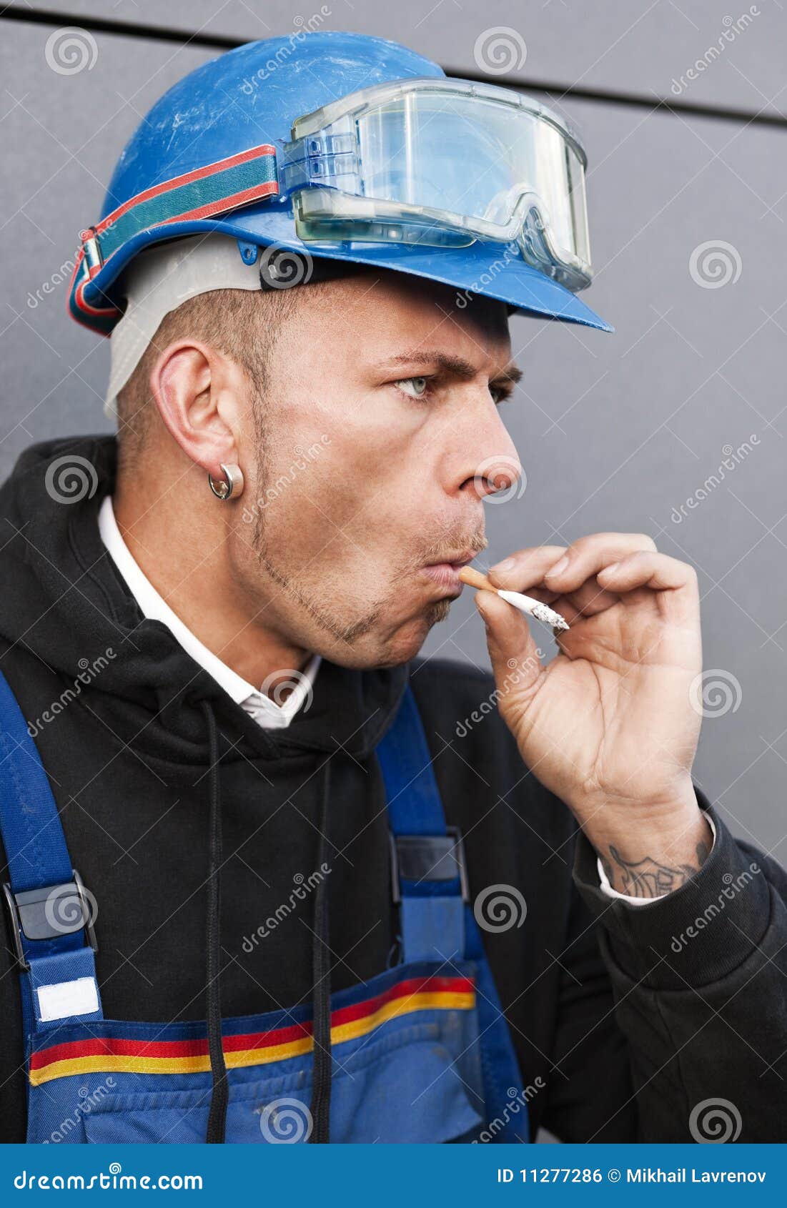 Smoking worker stock photo. Image of serious, site, worker - 11277286