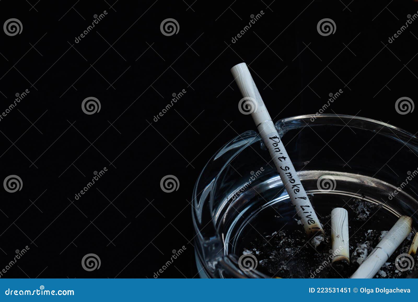 A Smoldering Cigarette in an Ashtray. the Harm of Smoking, Addiction ...