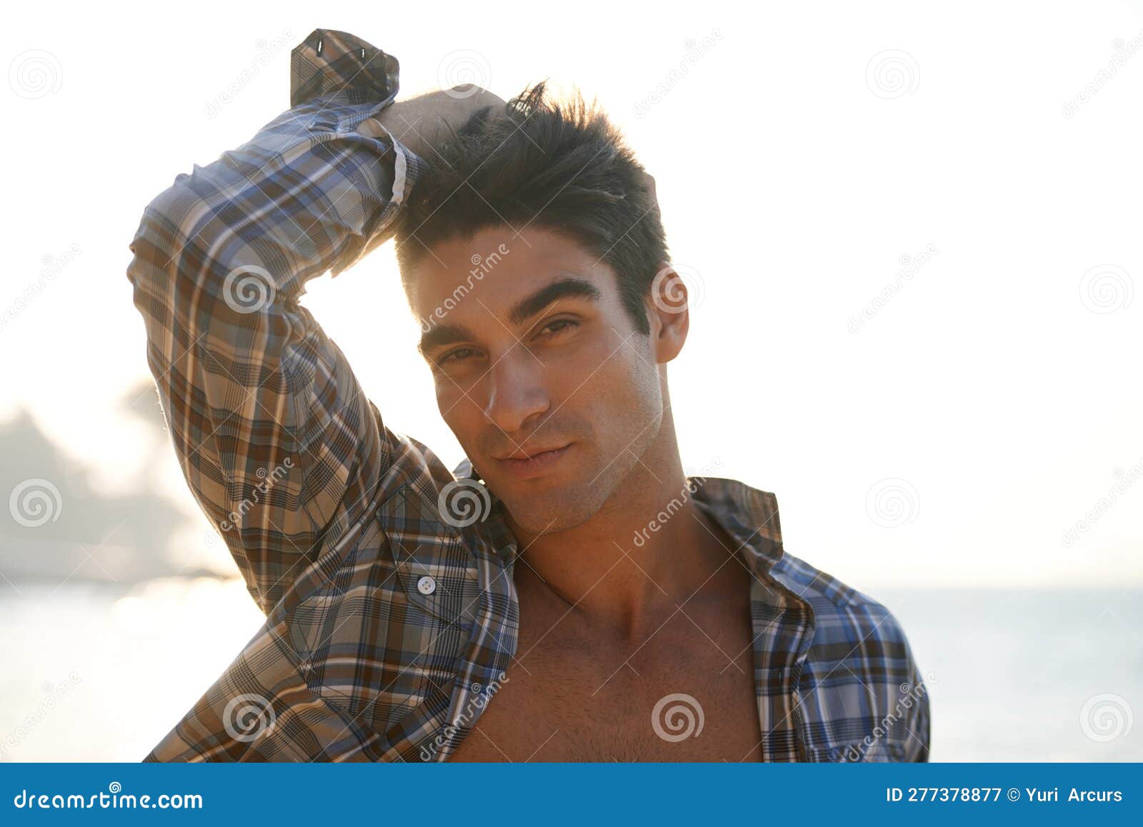 Smoldering Summer. a Handsome Young Man on the Beach. Stock Image ...