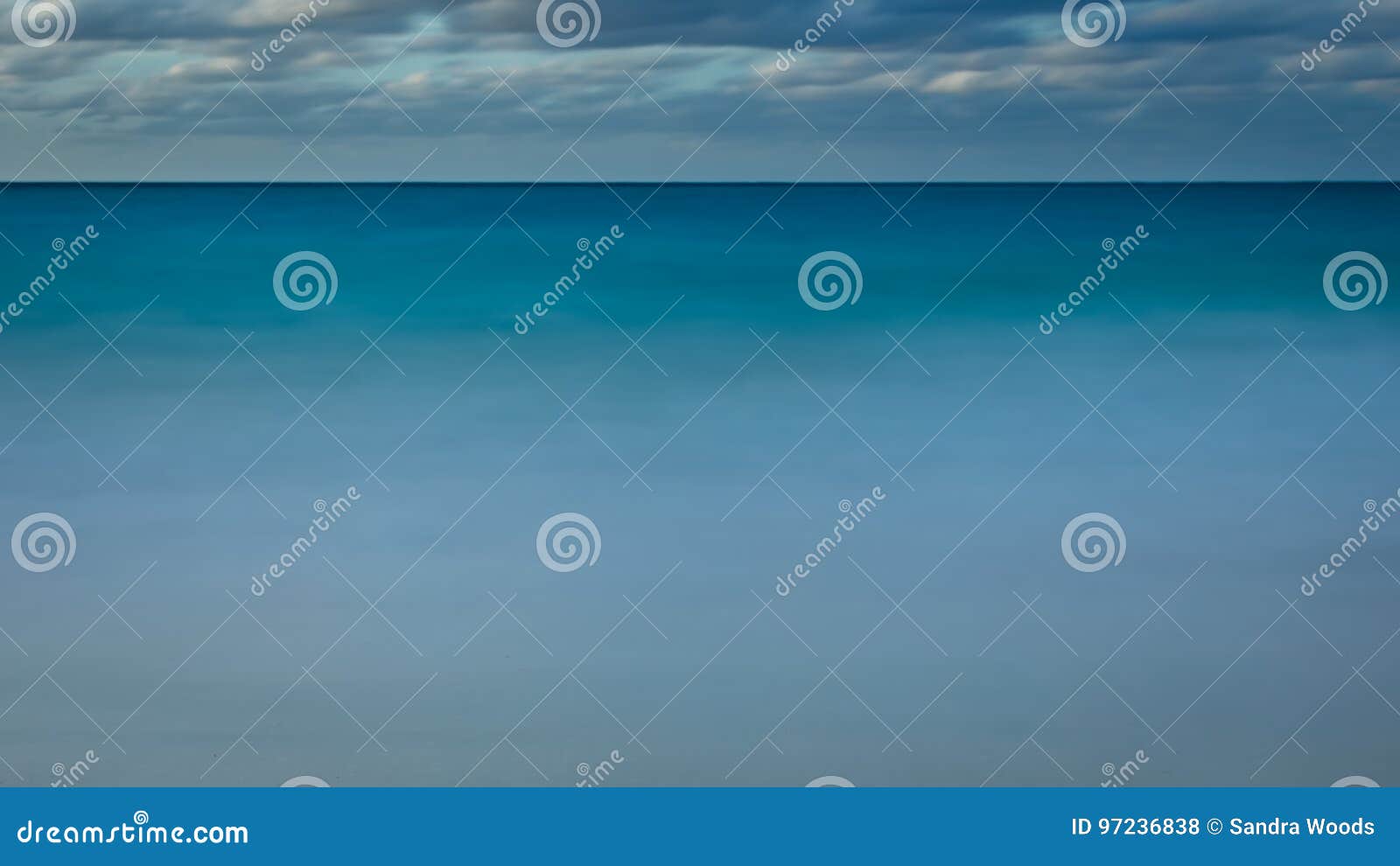 Smooth Blue Ocean stock photo. Image of ocean, clouds - 97236838