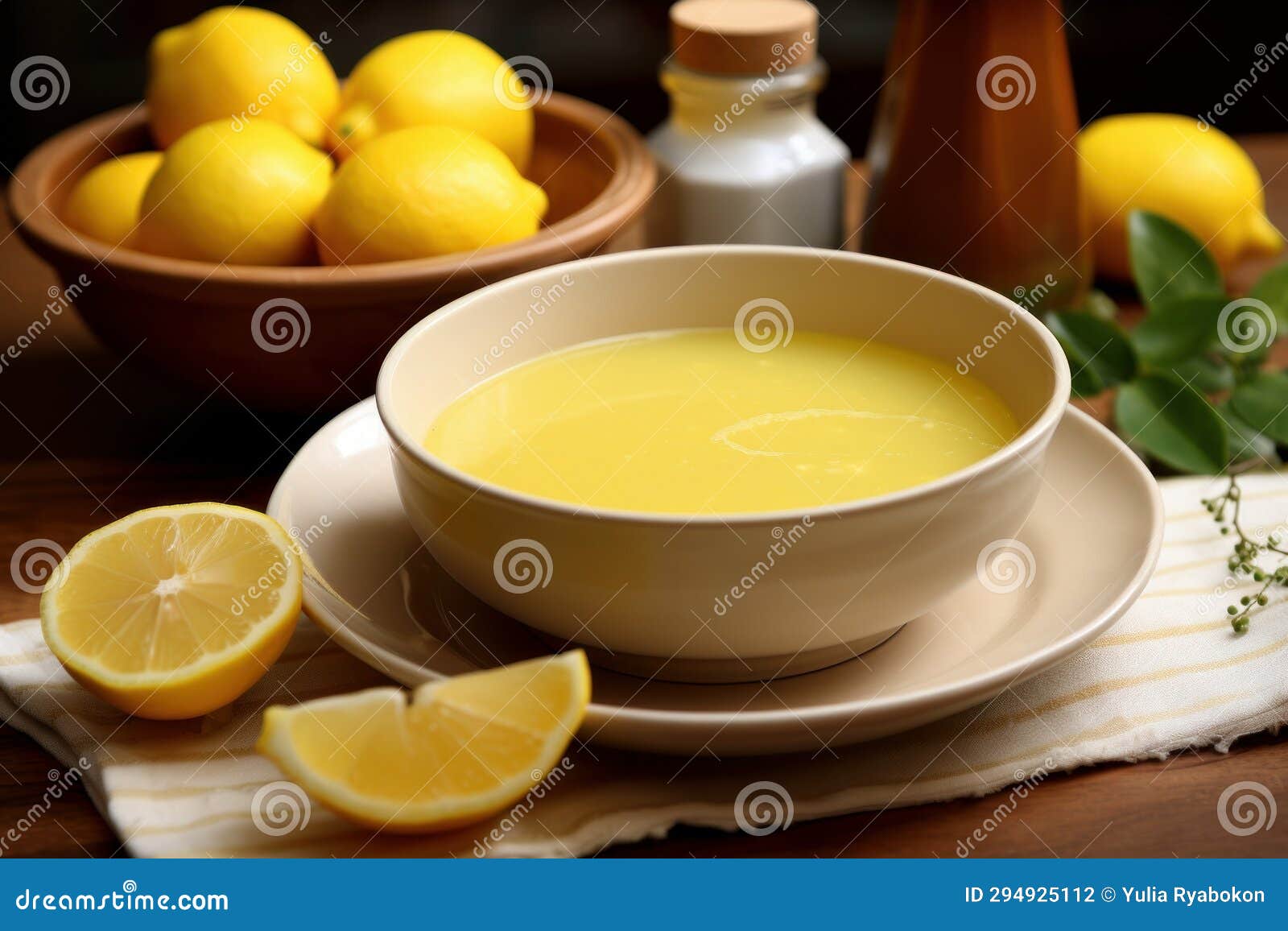 Bowl Of Lemon Juice And Pile Of Freshly Squeezed Lemons Stock ...