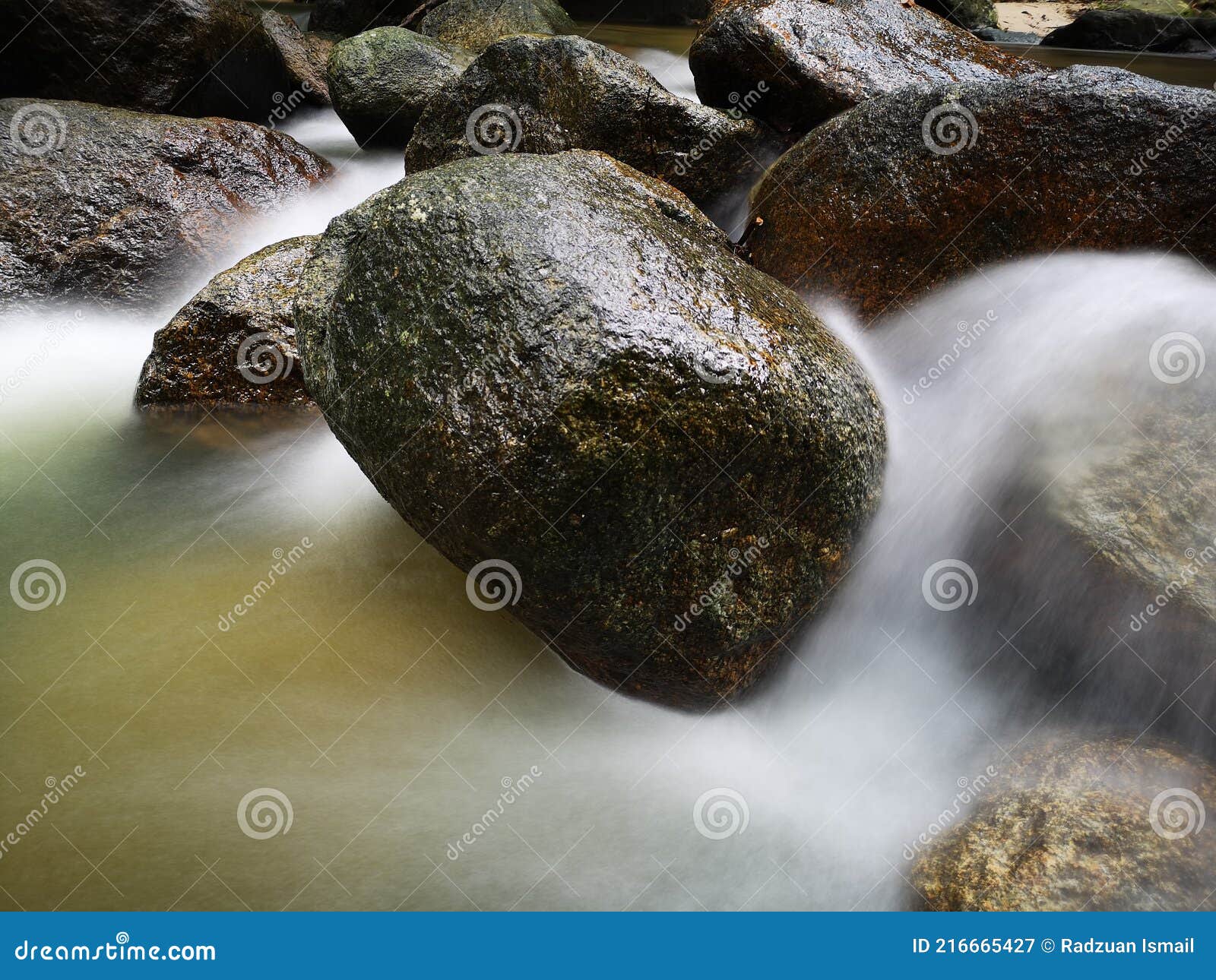 Smooth flowing stream stock image. Image of reflection - 216665427