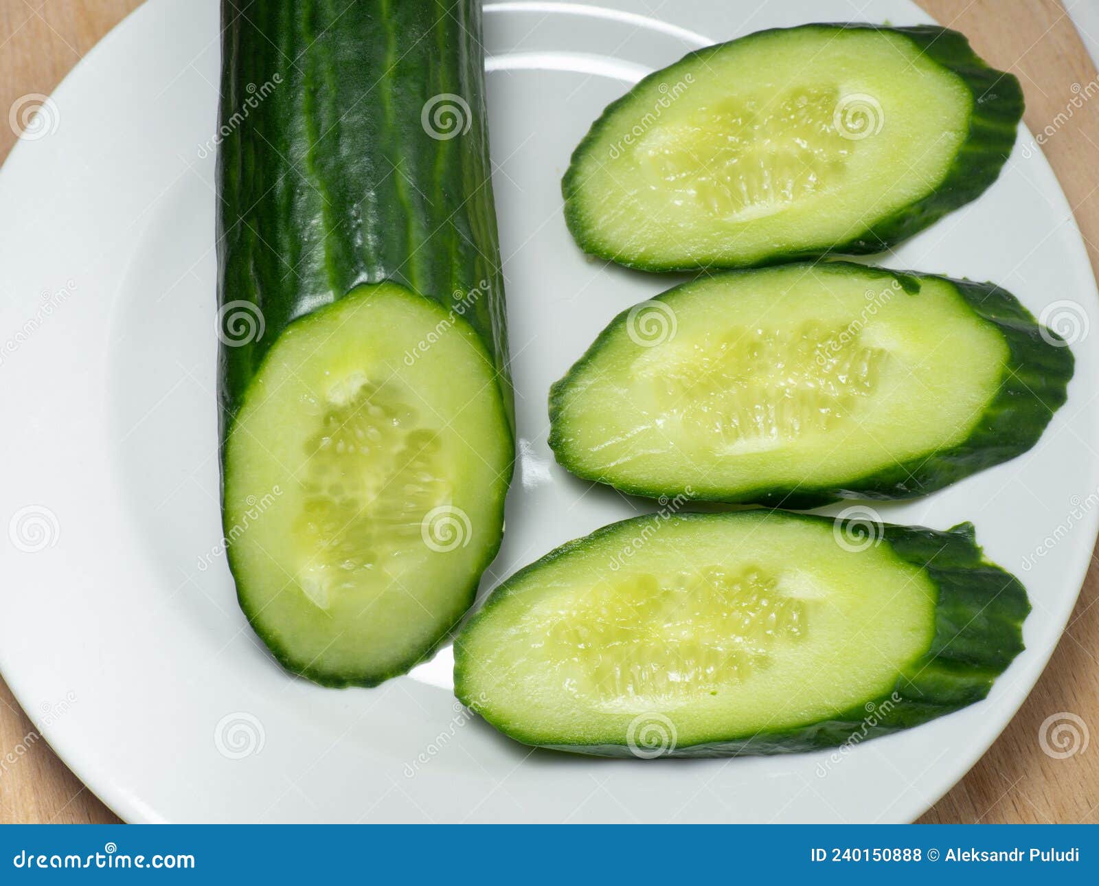 A Smooth, Medium-sized Cucumber Cut into Slices. Cucumber on a Plate ...