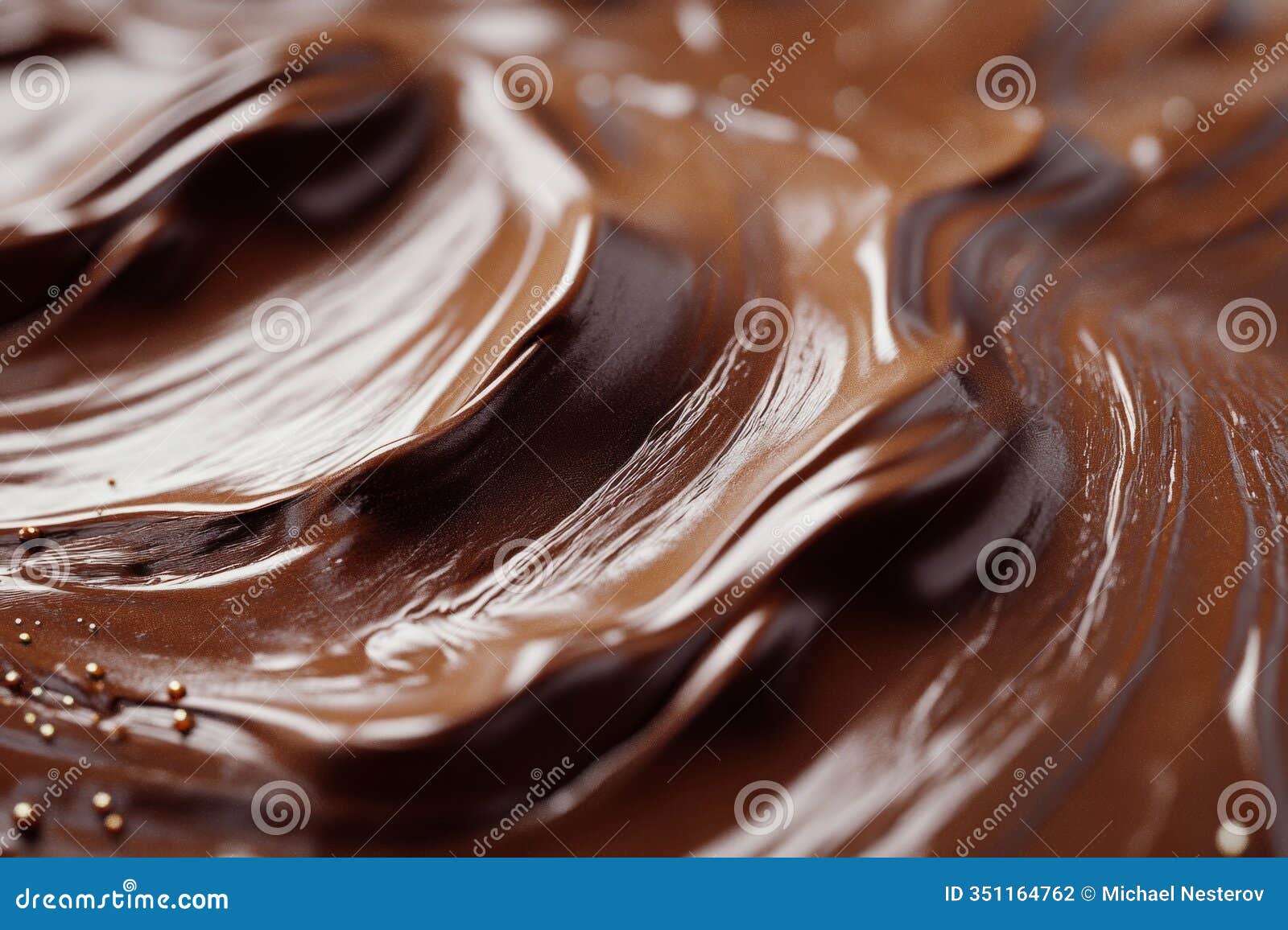 Smooth, Melted Chocolate Forms a Beautiful, Wavy Pattern, Creating a ...