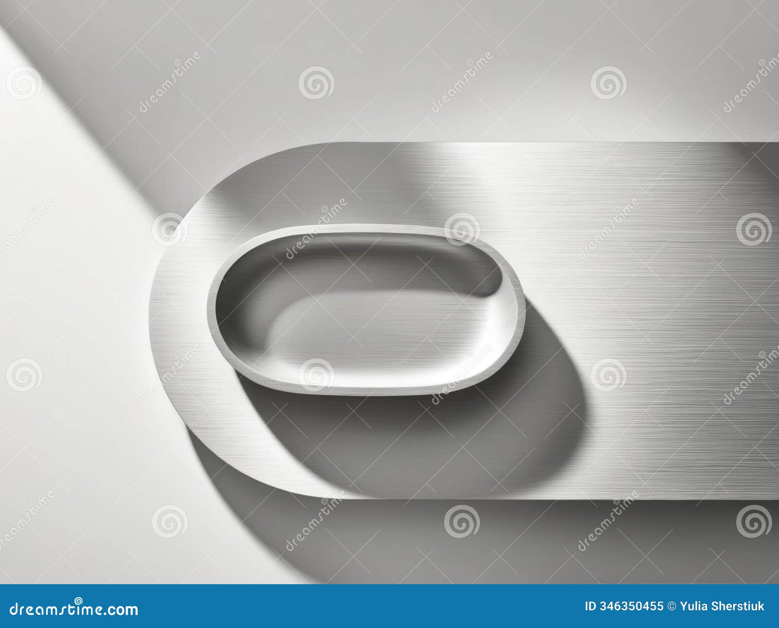 Smooth Metallic Surface Featuring an Elegant Oval Design with a Brushed ...