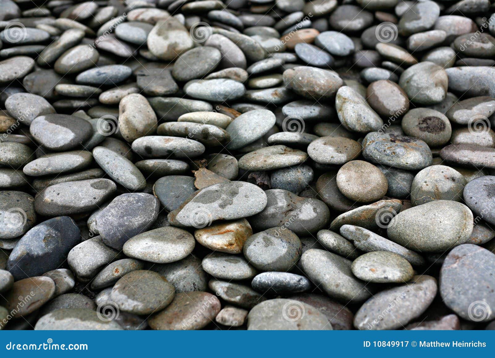 Smooth, round ocean rocks stock image. Image of beach - 10849917