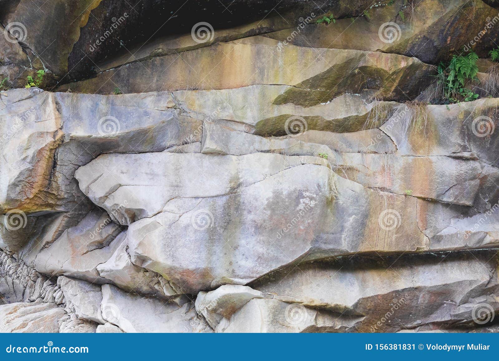 A Smooth Stone that Lies in Layers in a Mountain Rock_ Stock Image ...