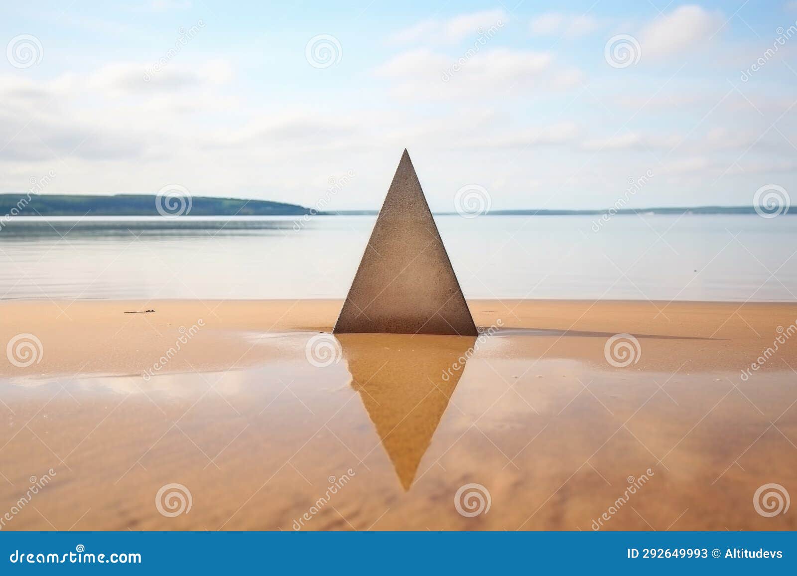 A Smooth Stone Pyramid on a Sandy Beach Stock Image - Image of smooth ...
