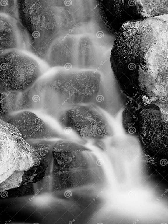 Smooth waterfall and rocks stock photo. Image of white - 5469666