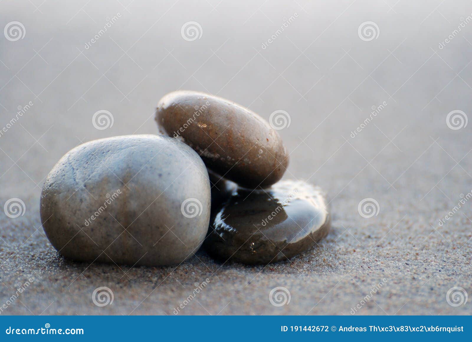 Smooth Wet Stones in a Pile on a Beach Stock Photo - Image of stones ...