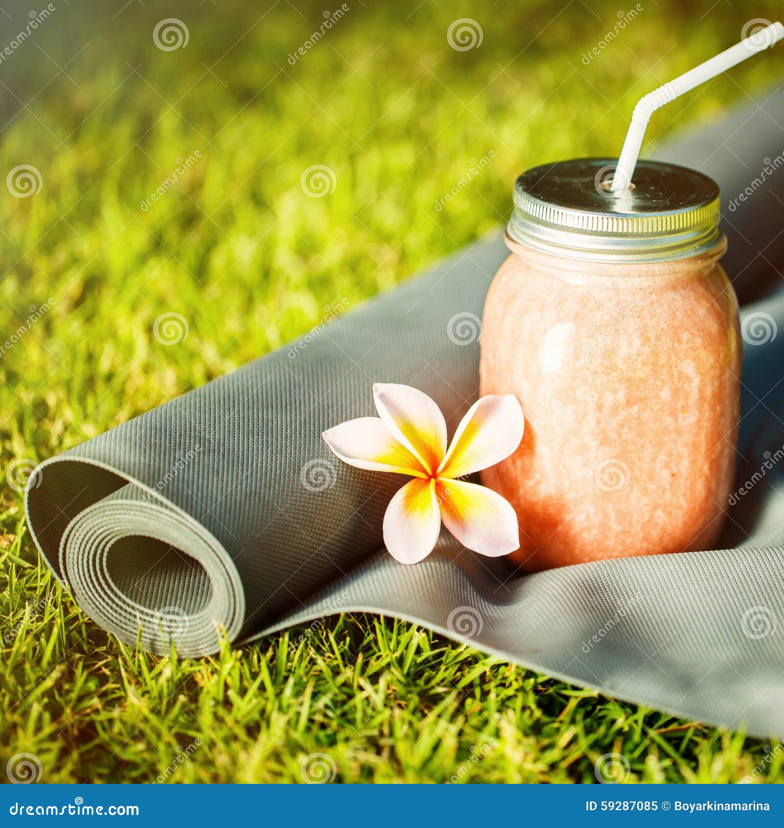 Smoothies and Yoga Mat on the Grass Stock Image - Image of green ...