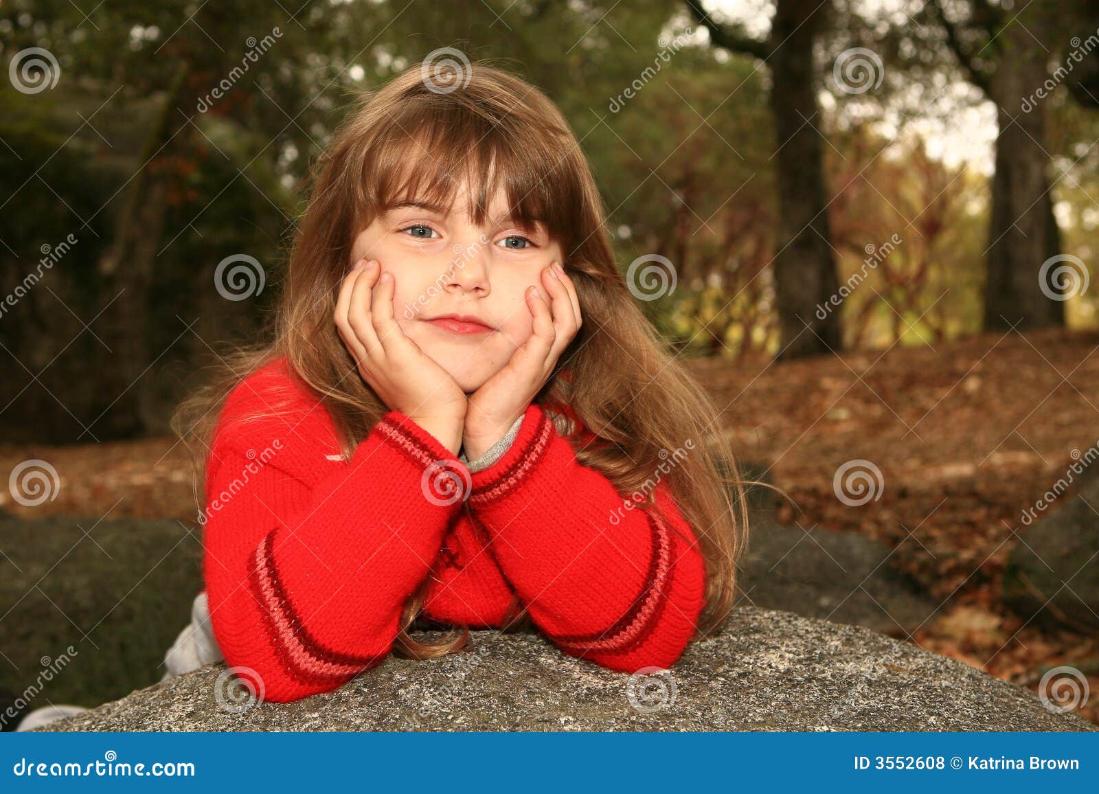 Smug Young Girl Outdoors On A Rock Picture. Image: 3552608
