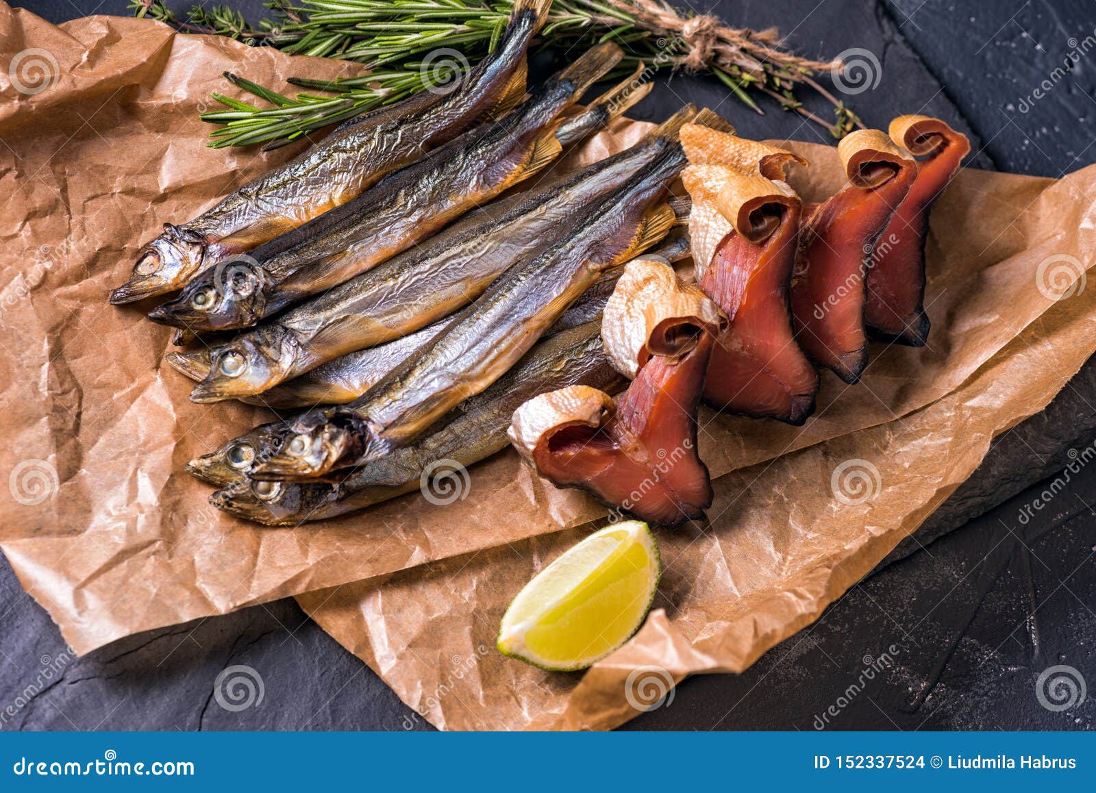 Snack. Dry Fish on the Table in Paper Ready To Eat Stock Photo - Image ...