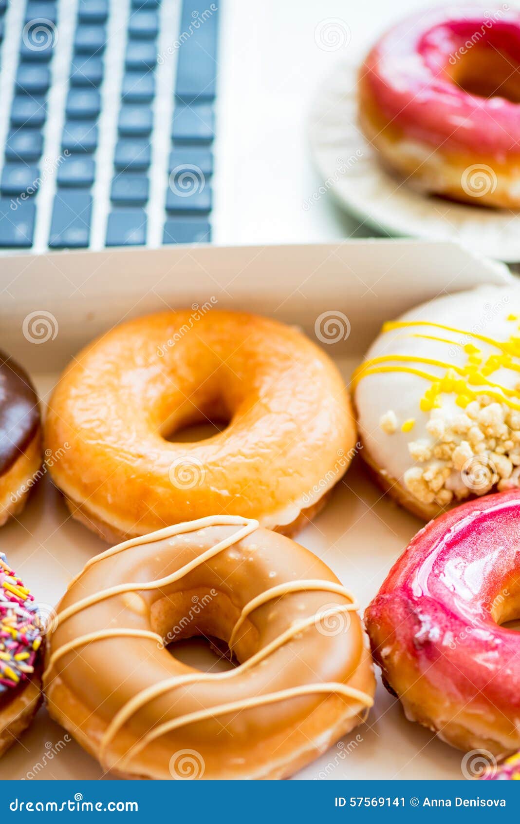 Snack from Glazed Doughnuts Near Laptop on Working Desk Stock Image ...