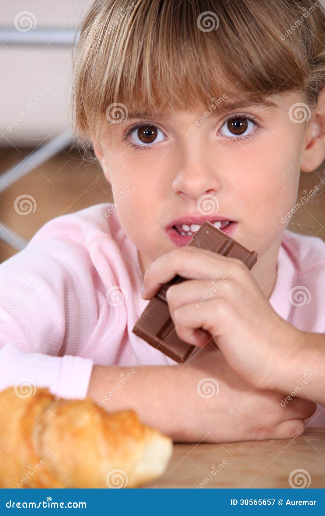 Snacking on chocolate stock image. Image of appetite - 30565657