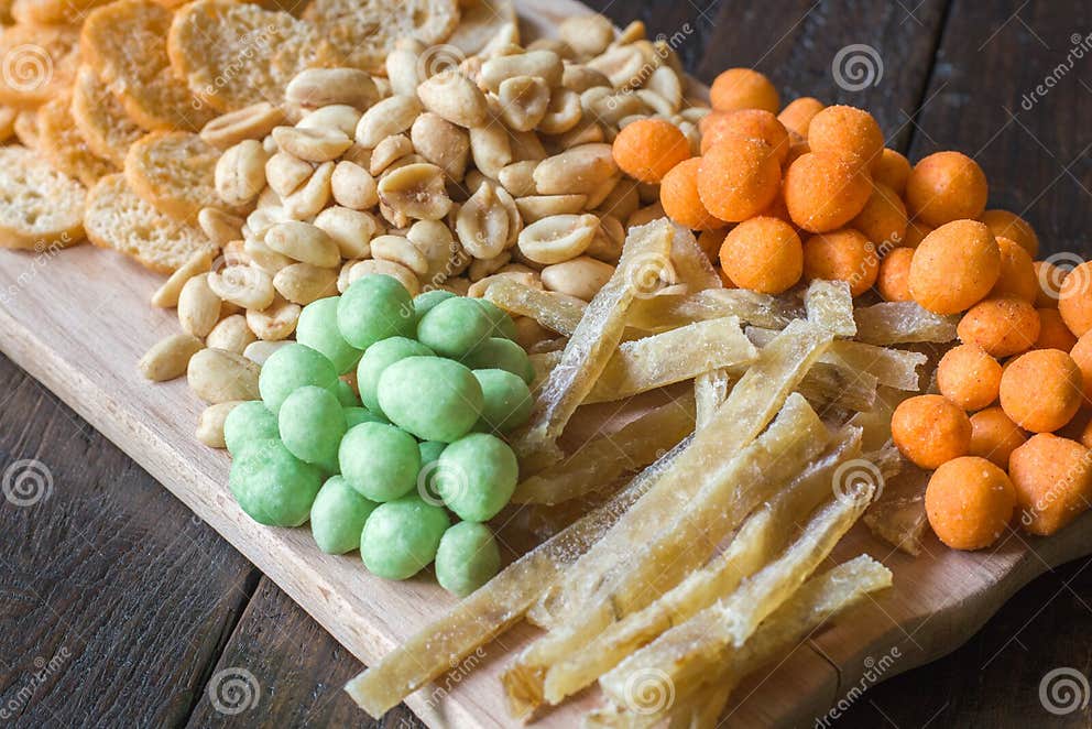 Snacks for Beer on the Table in the Pub. Peanuts, Peanuts in a Shell ...