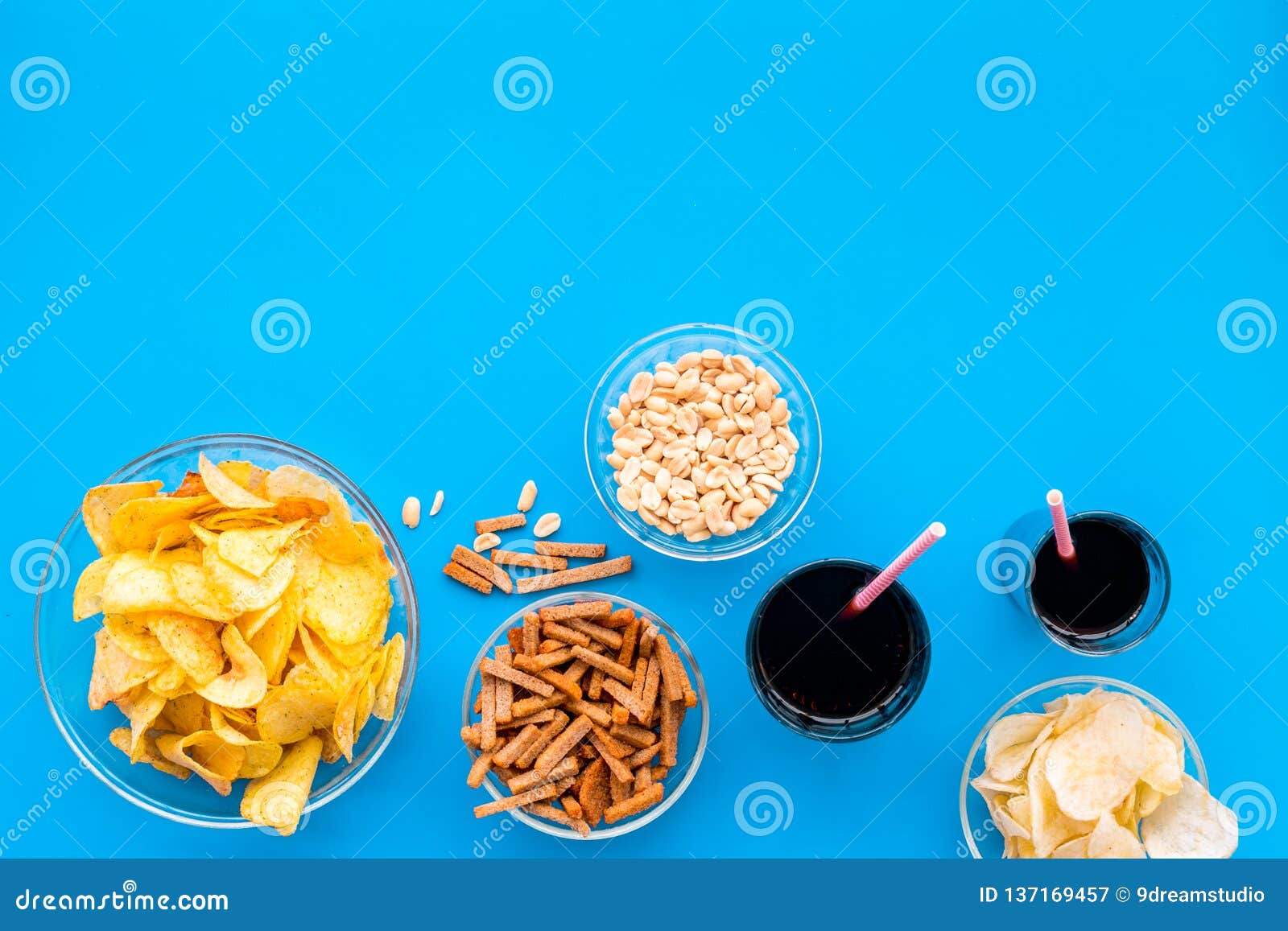 Snacks for TV Watching. Chips, Nuts, Soda, Rusks on Blue Background Top ...
