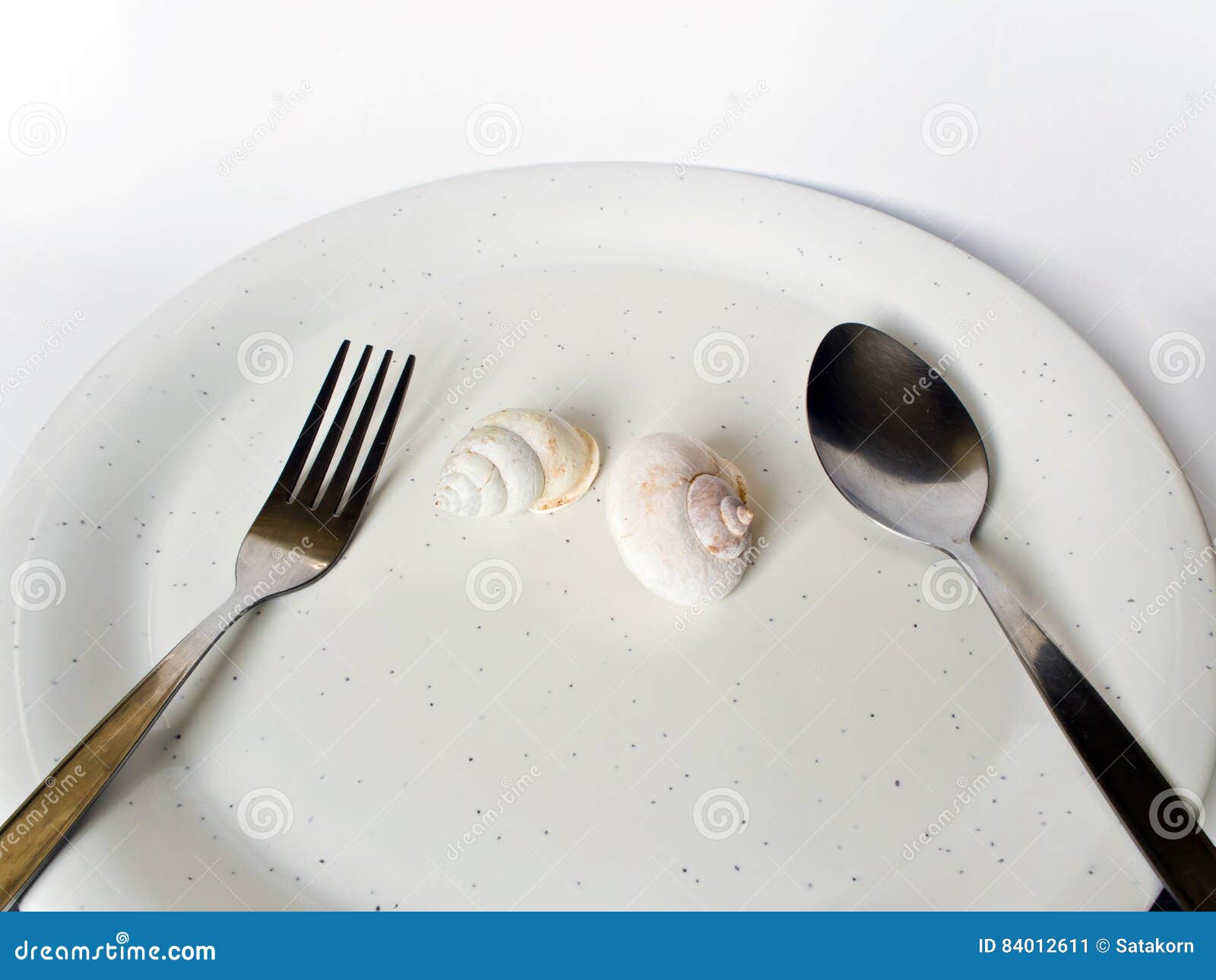 Snail Shell in a Dish with Spoon and Fork Stock Image - Image of nature ...
