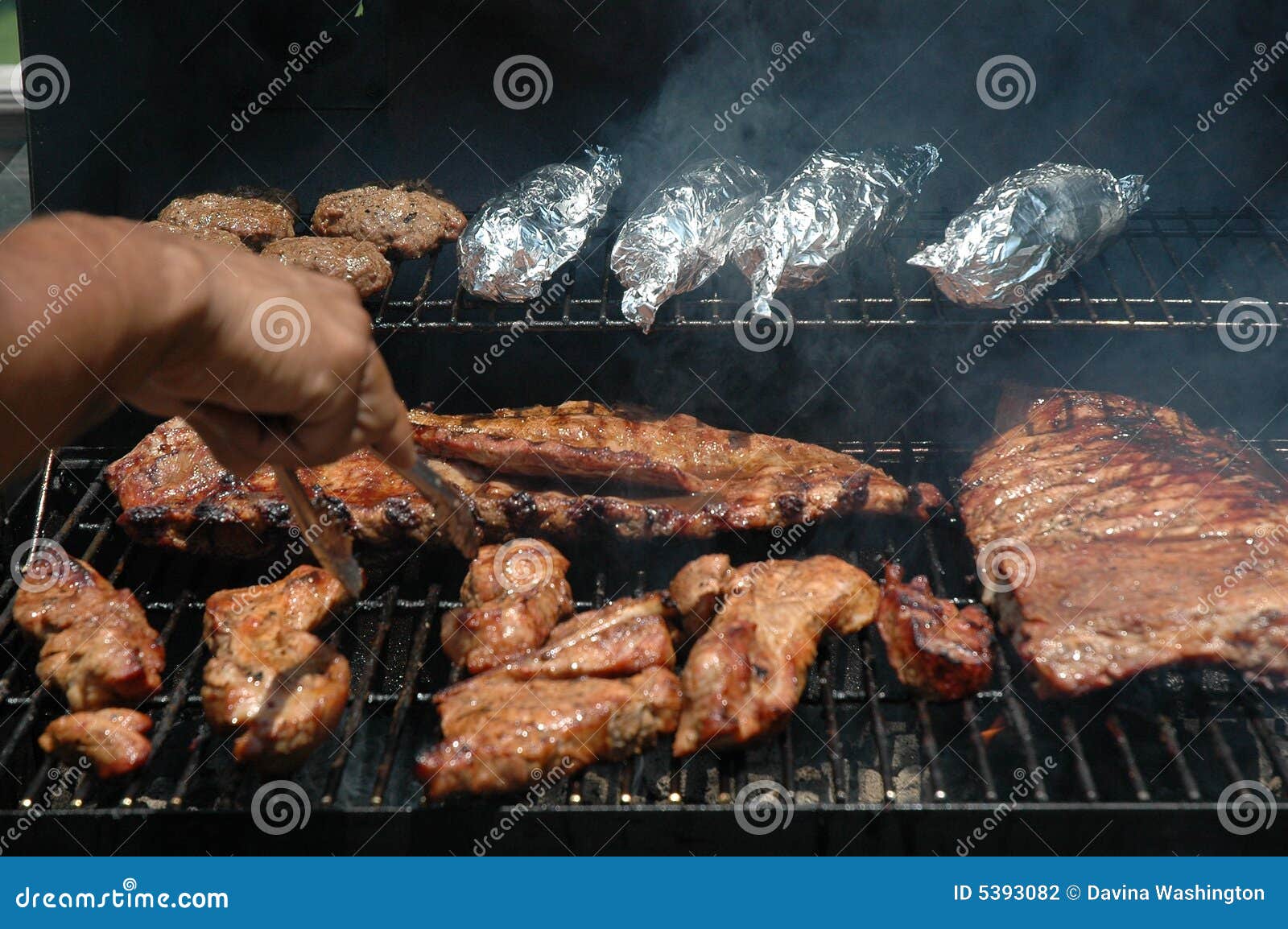 Sneak a Taste stock photo. Image of heat, barbecue, juicy - 5393082