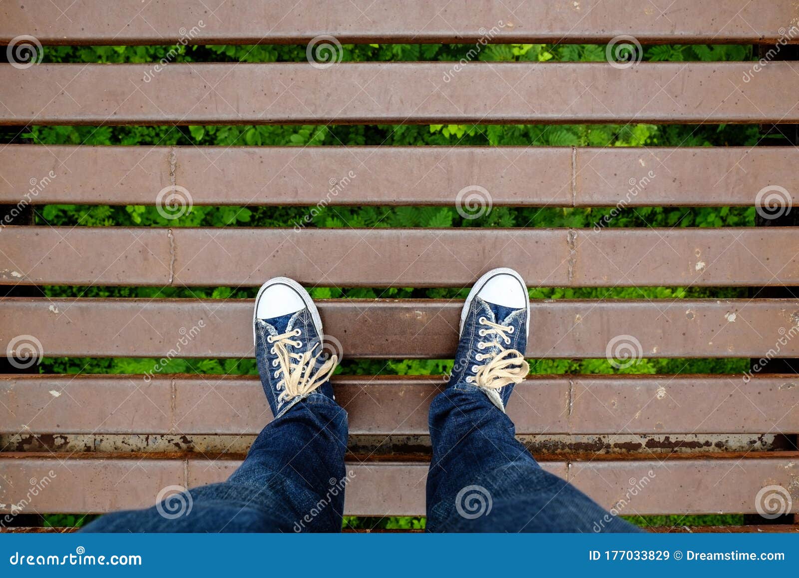 Sneaker with Feet on the Wood Bridge Stock Image - Image of foot, shoes ...