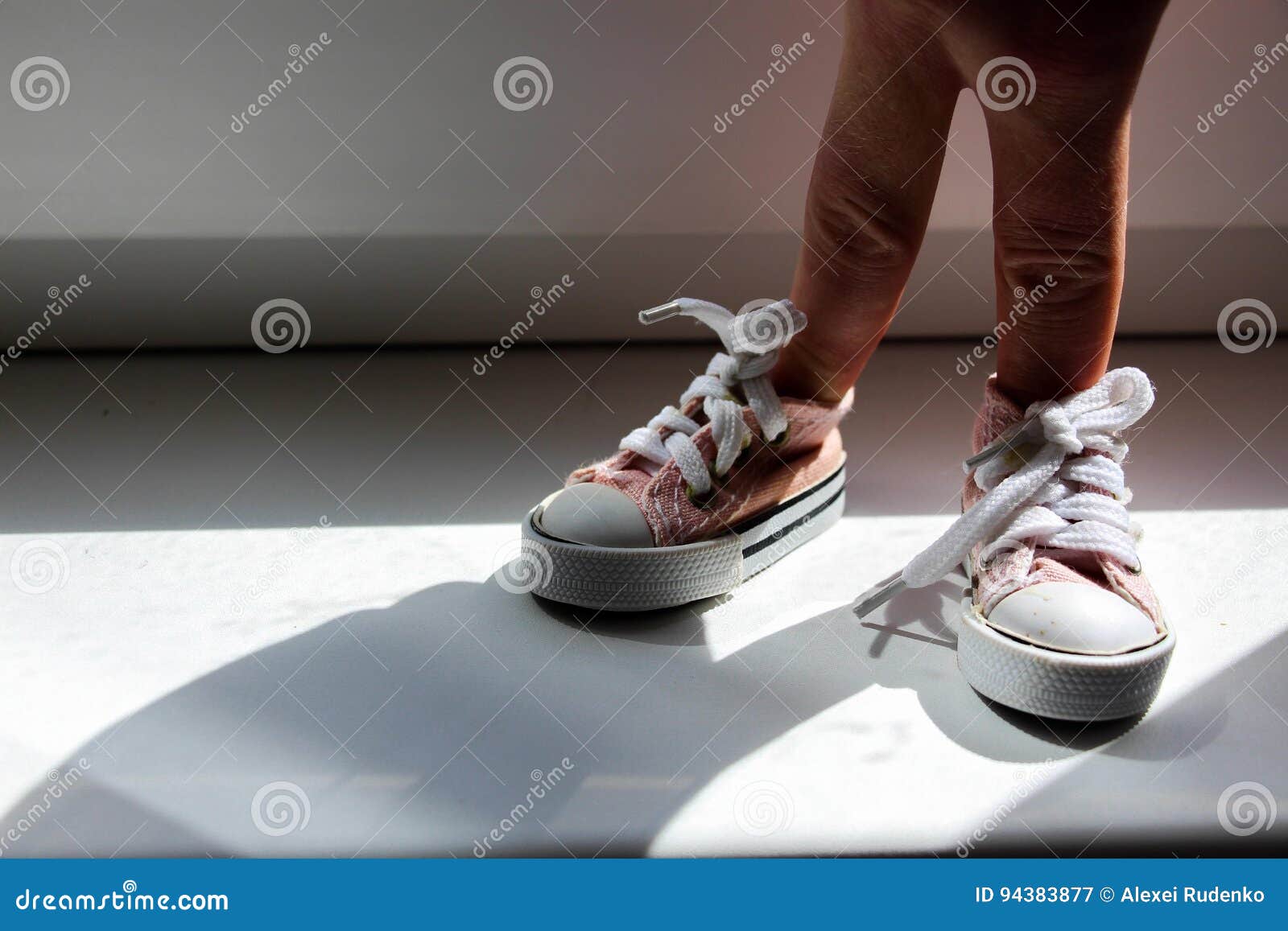 Sneakers on the fingers. stock image. Image of standing - 94383877