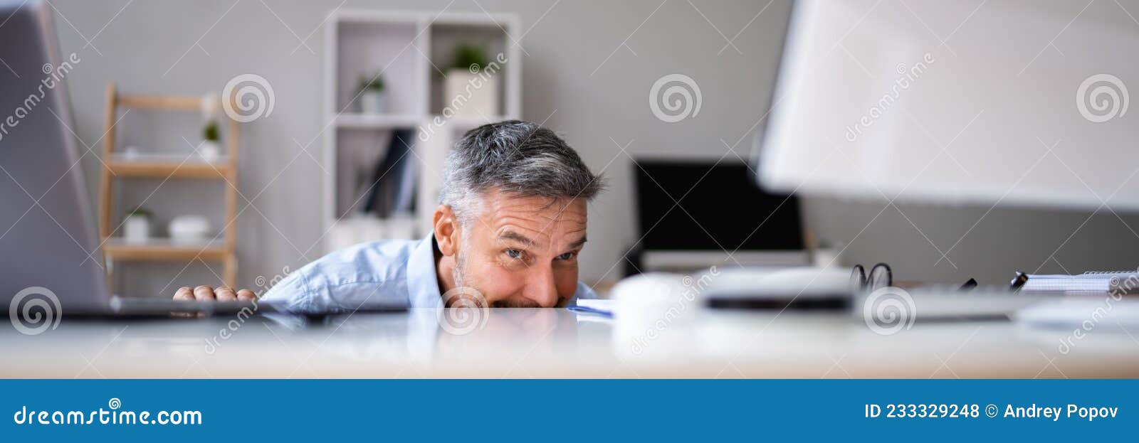 Sneaky Mature Man Avoiding Work Stock Photo - Image of office, male ...