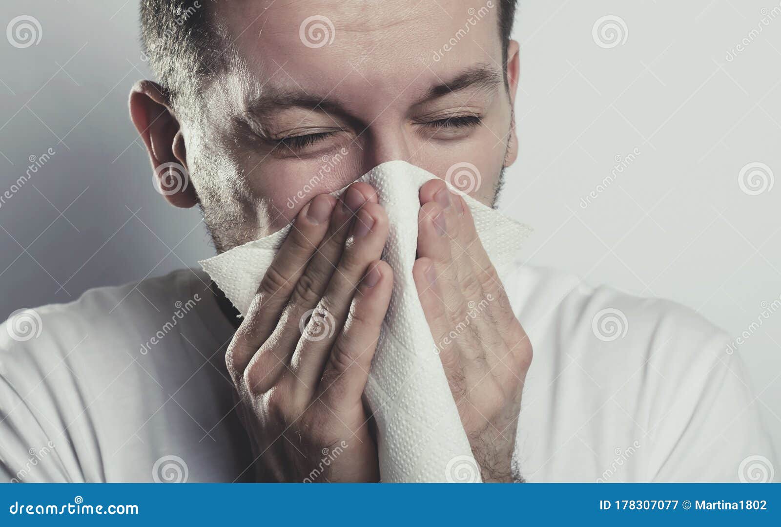 Sneezing young man stock image. Image of nose, face - 178307077