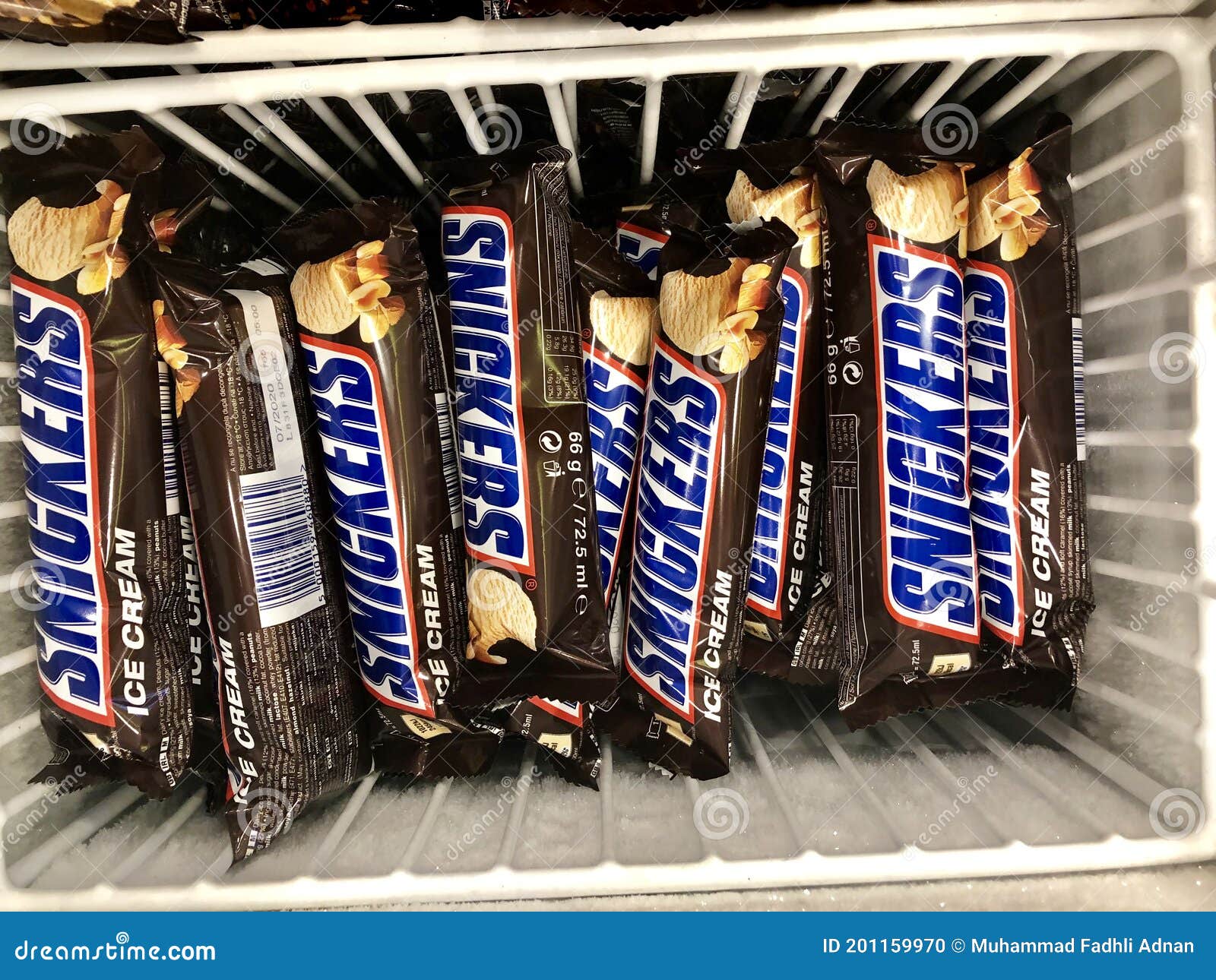 Snickers Ice cream editorial image. Image of candy, hand - 201159970