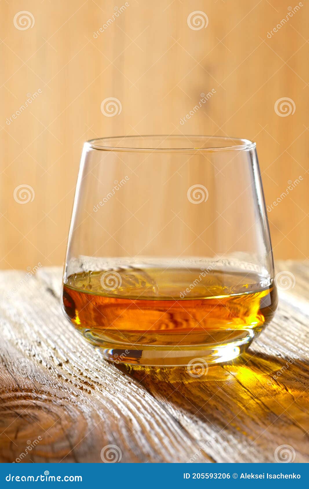 Sniffer Glass with Whiskey on Wooden Table in Sunlight. Stock Photo ...