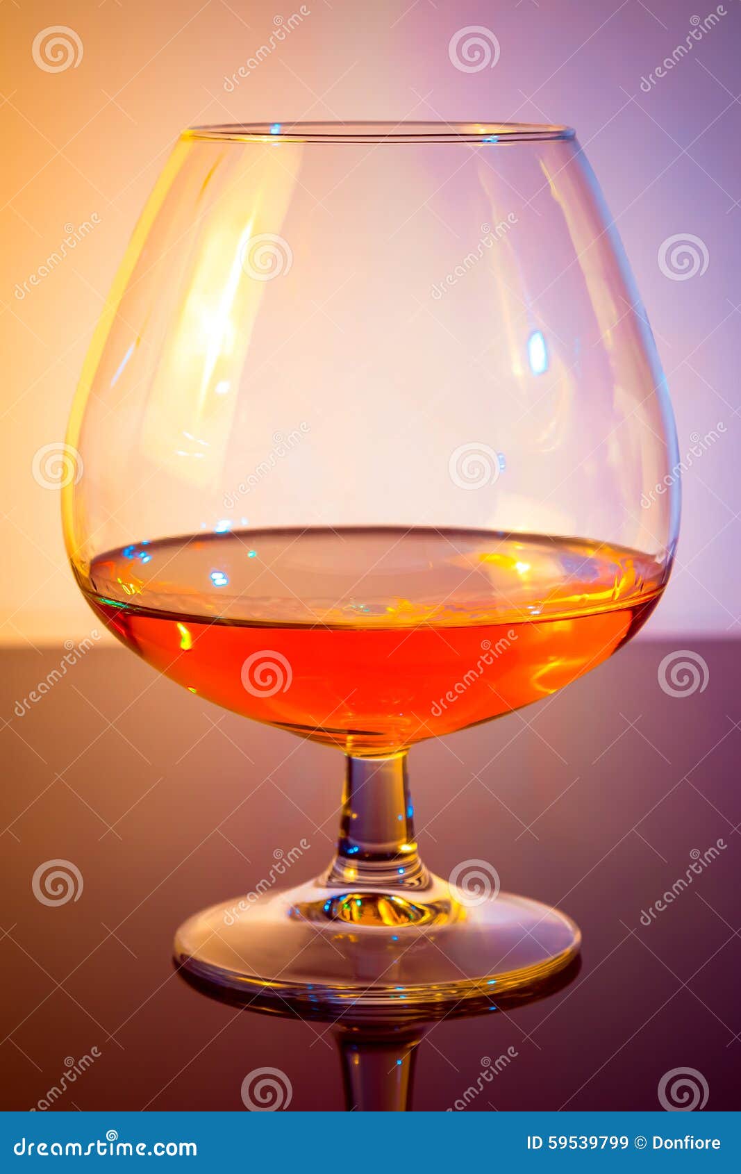 Snifter Of Brandy In Elegant Typical Cognac Glass On Blue Light ...
