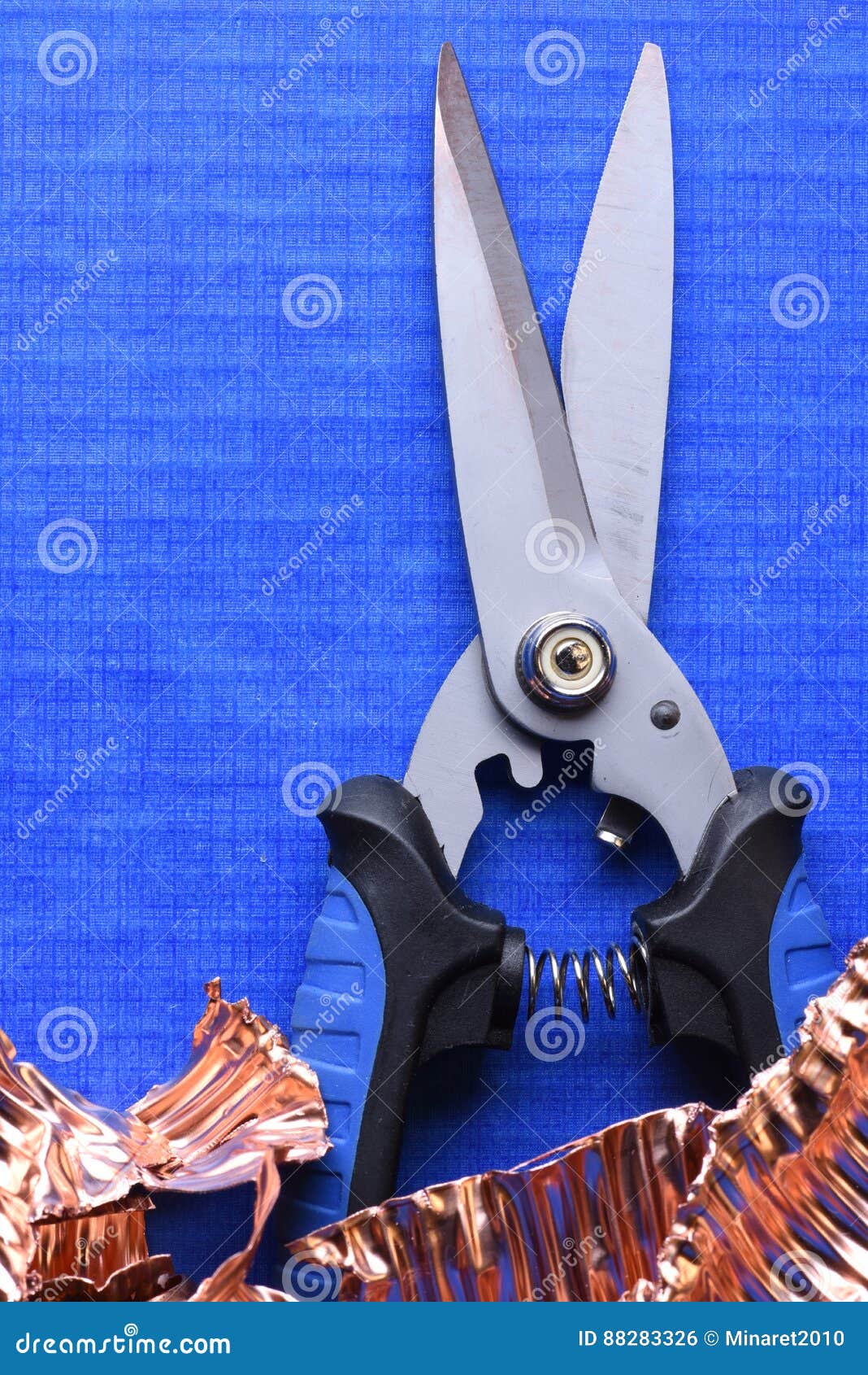Snip Cutter and Copper Scrap on Blue Background Stock Photo - Image of ...