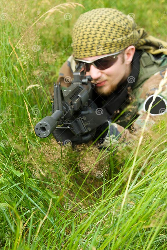 Sniper laying in a grass stock image. Image of shooting - 10782093