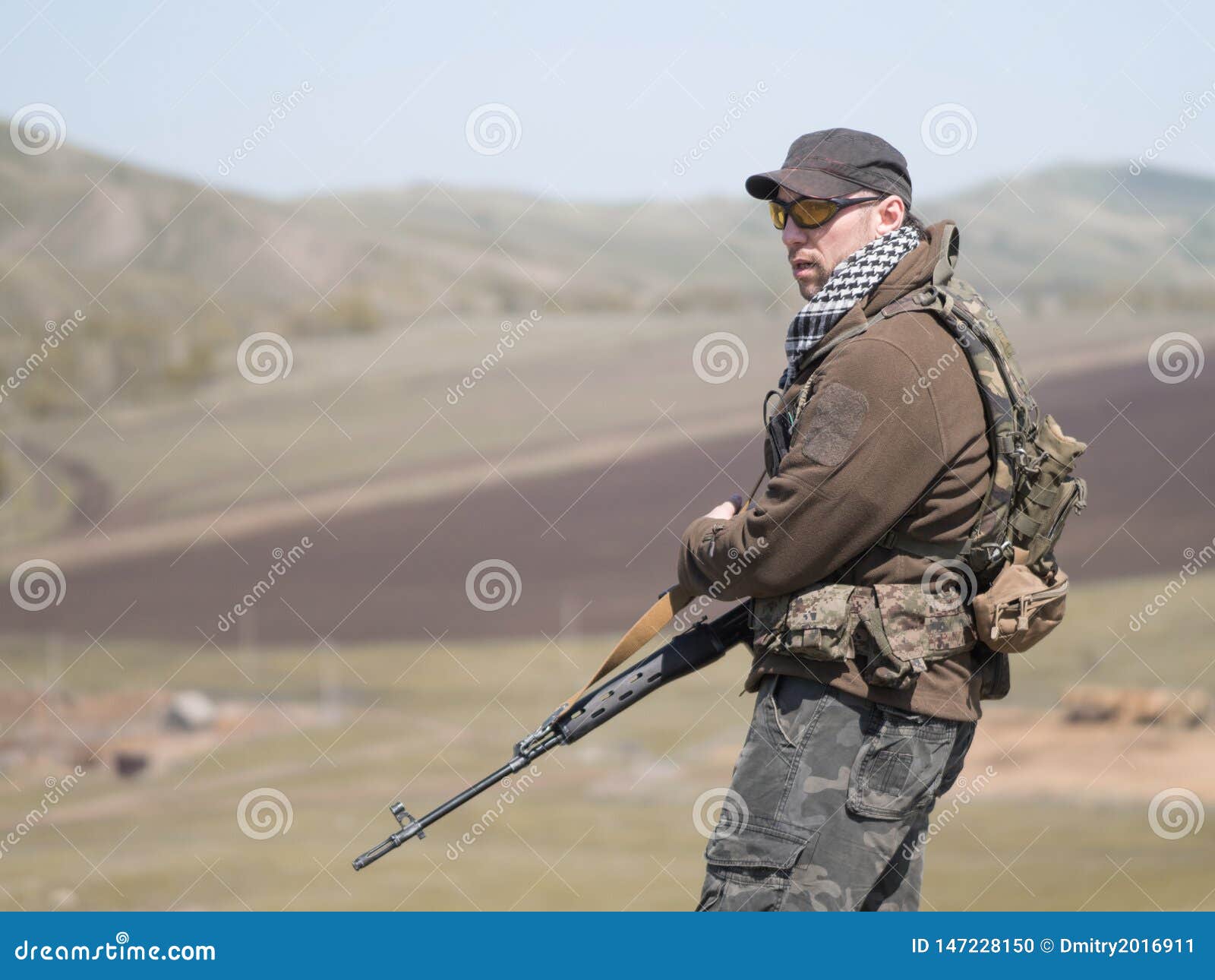 Sniper Standing with Arms and Looking To the Side. Stock Photo - Image ...