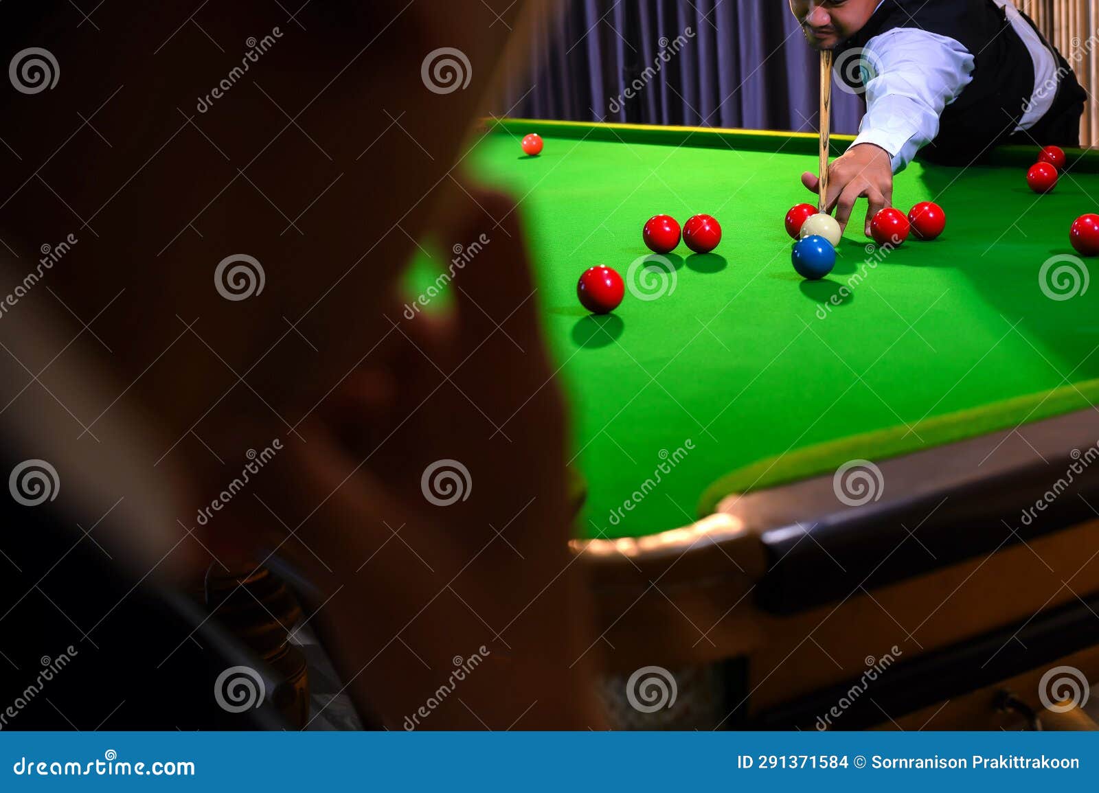 Snooker Player while Aiming To White Ball Shoot To Hit the Snooker Ball ...