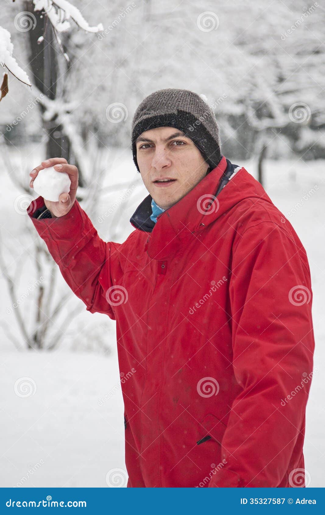 Young Man Throwing Snowballs To Someone Stock Image - Image of smile ...