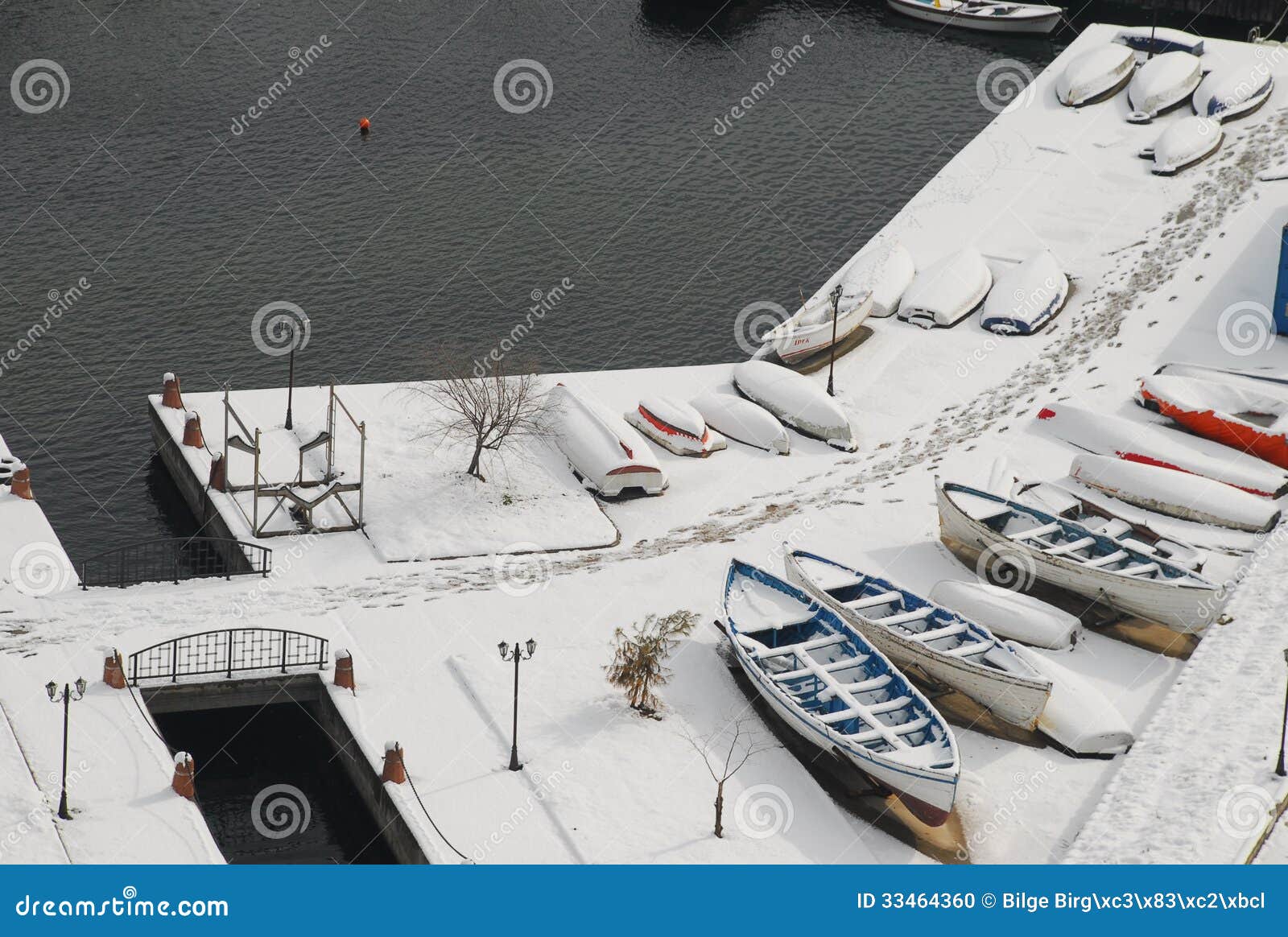 Snow and boats stock photo. Image of lake, green, white - 33464360