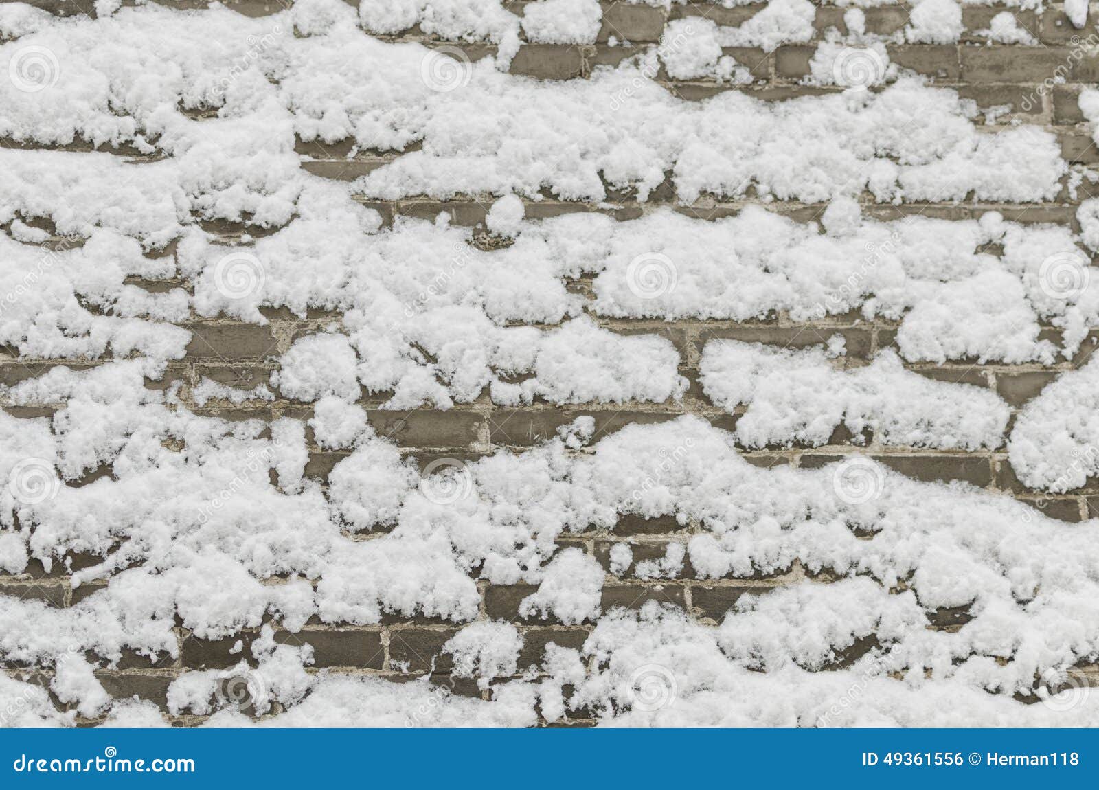 Snow on a brick wall stock photo. Image of wall, brick - 49361556