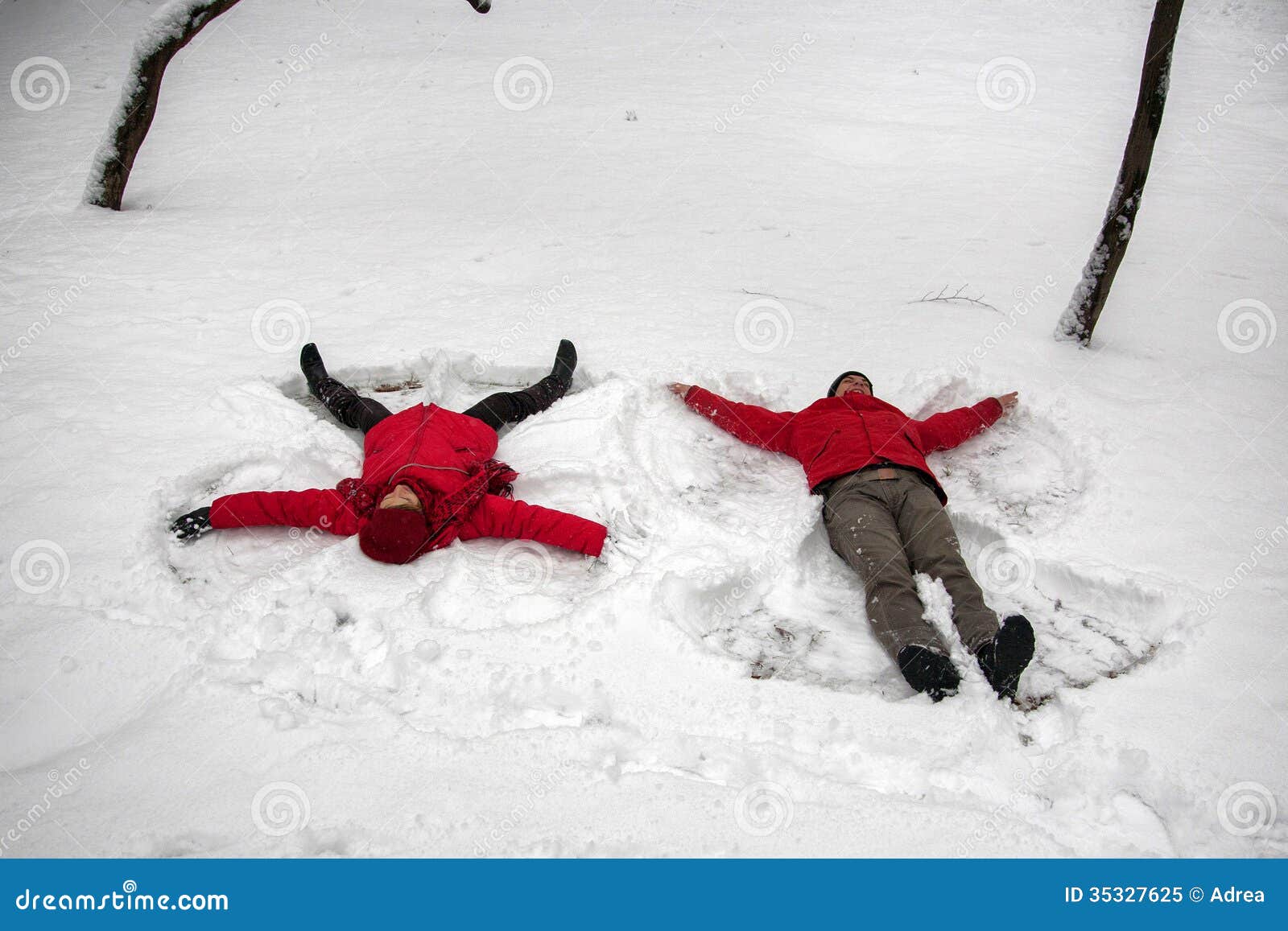 Young Couple Making Snow Butterfly Stock Image - Image of figure ...